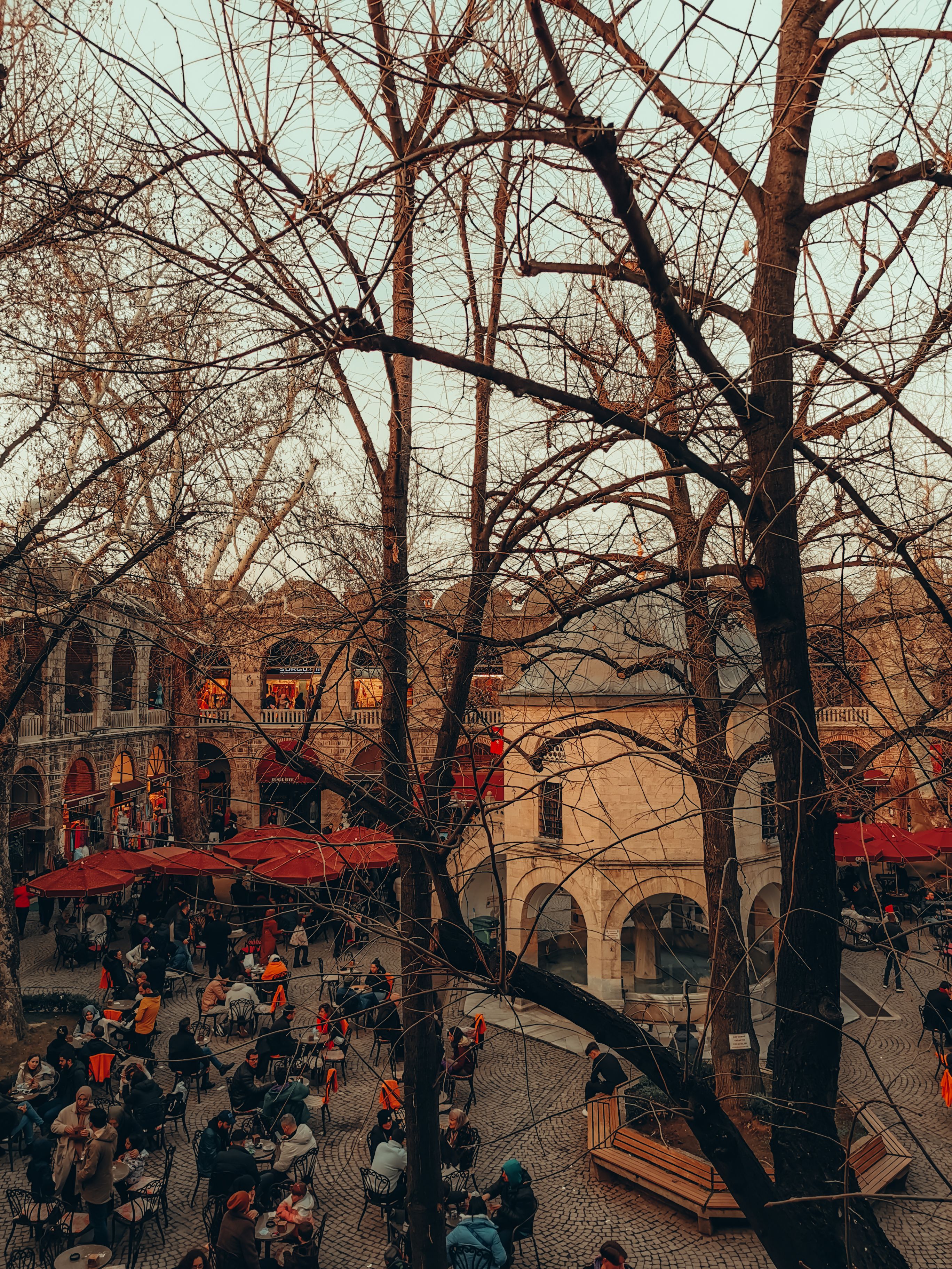 Lively Outdoor Cafe in Historic Bursa Setting · Free Stock Photo