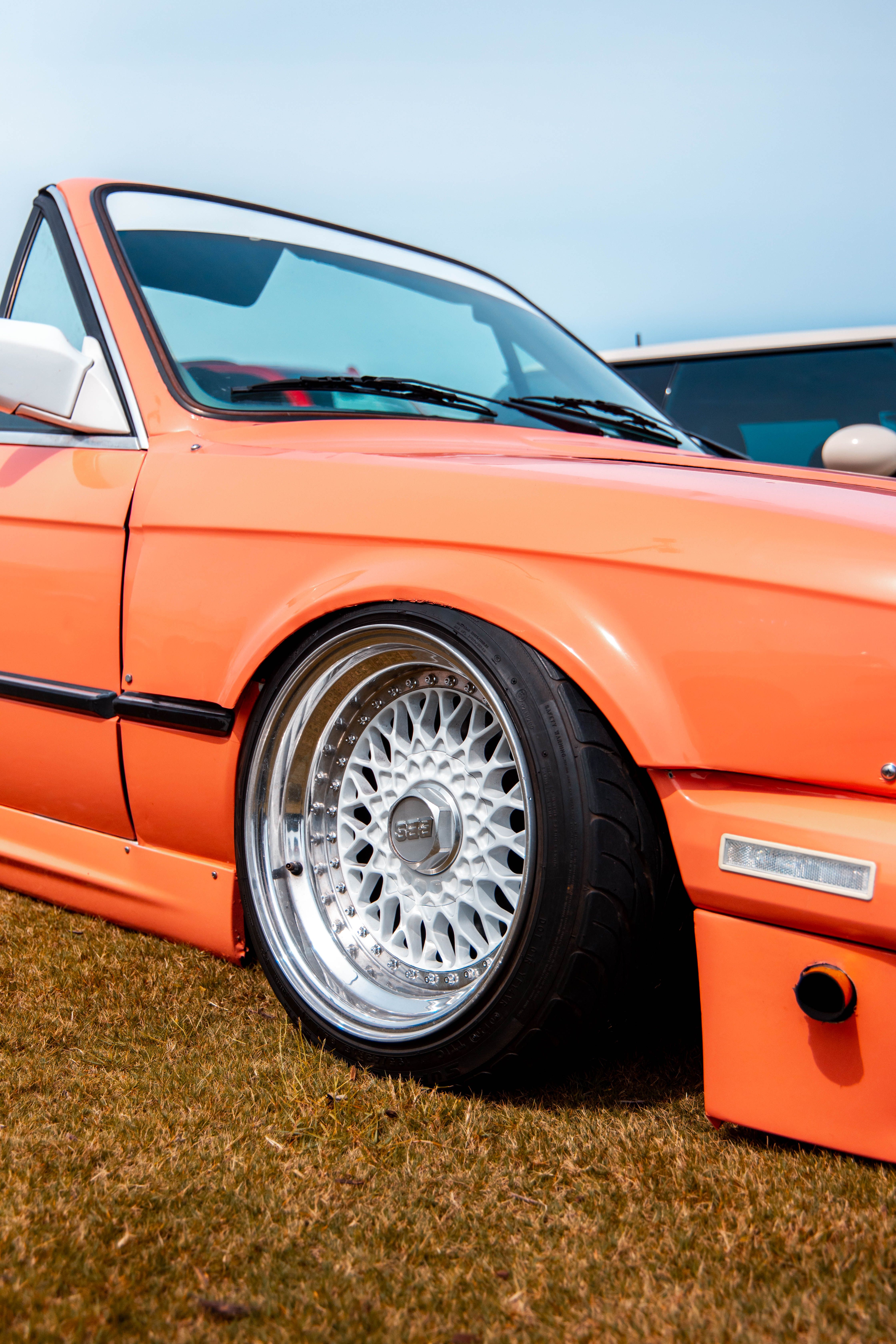 Retro Orange Convertible with Custom Wheels · Free Stock Photo