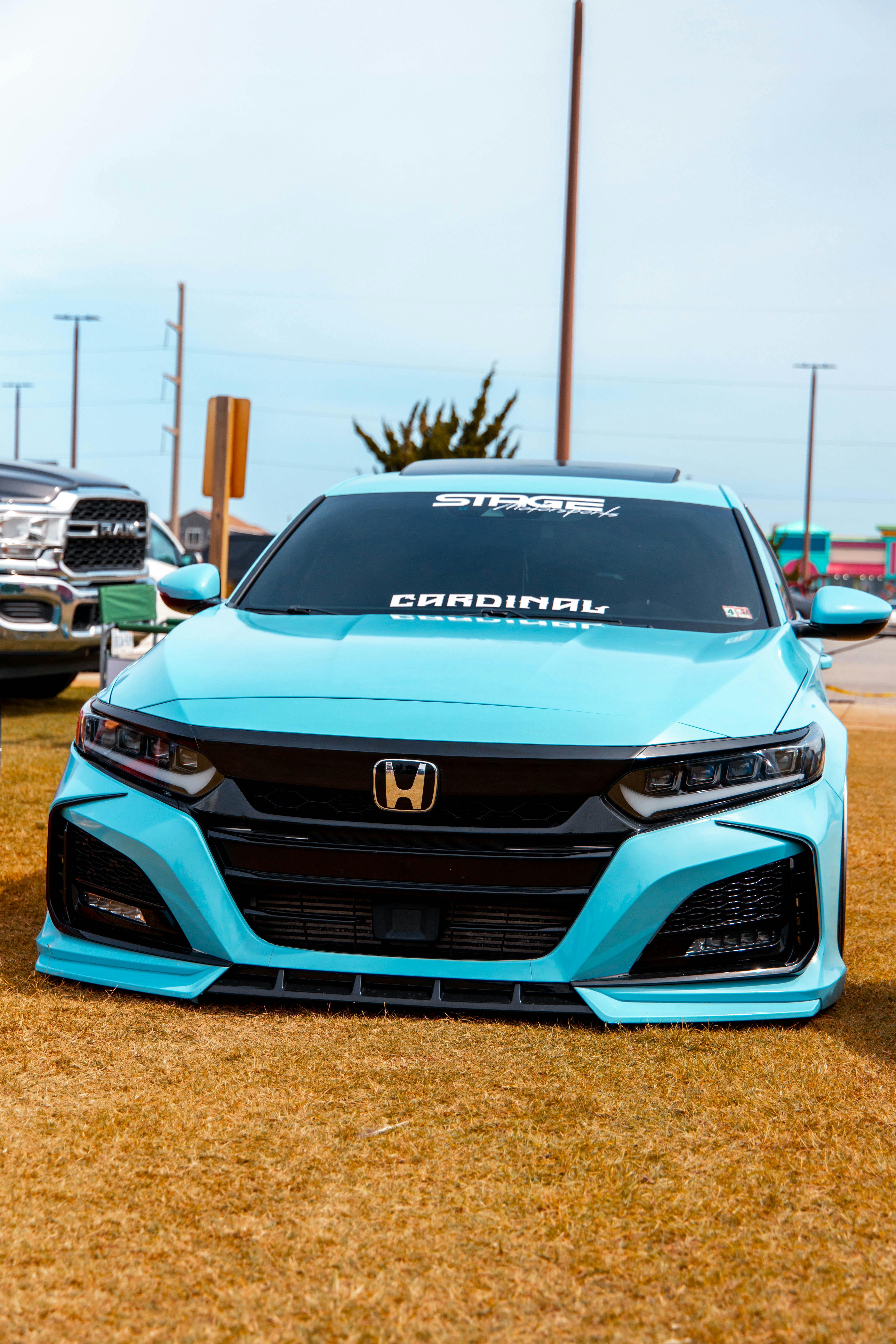 Front view of a blue modified Honda car on display · Free Stock Photo
