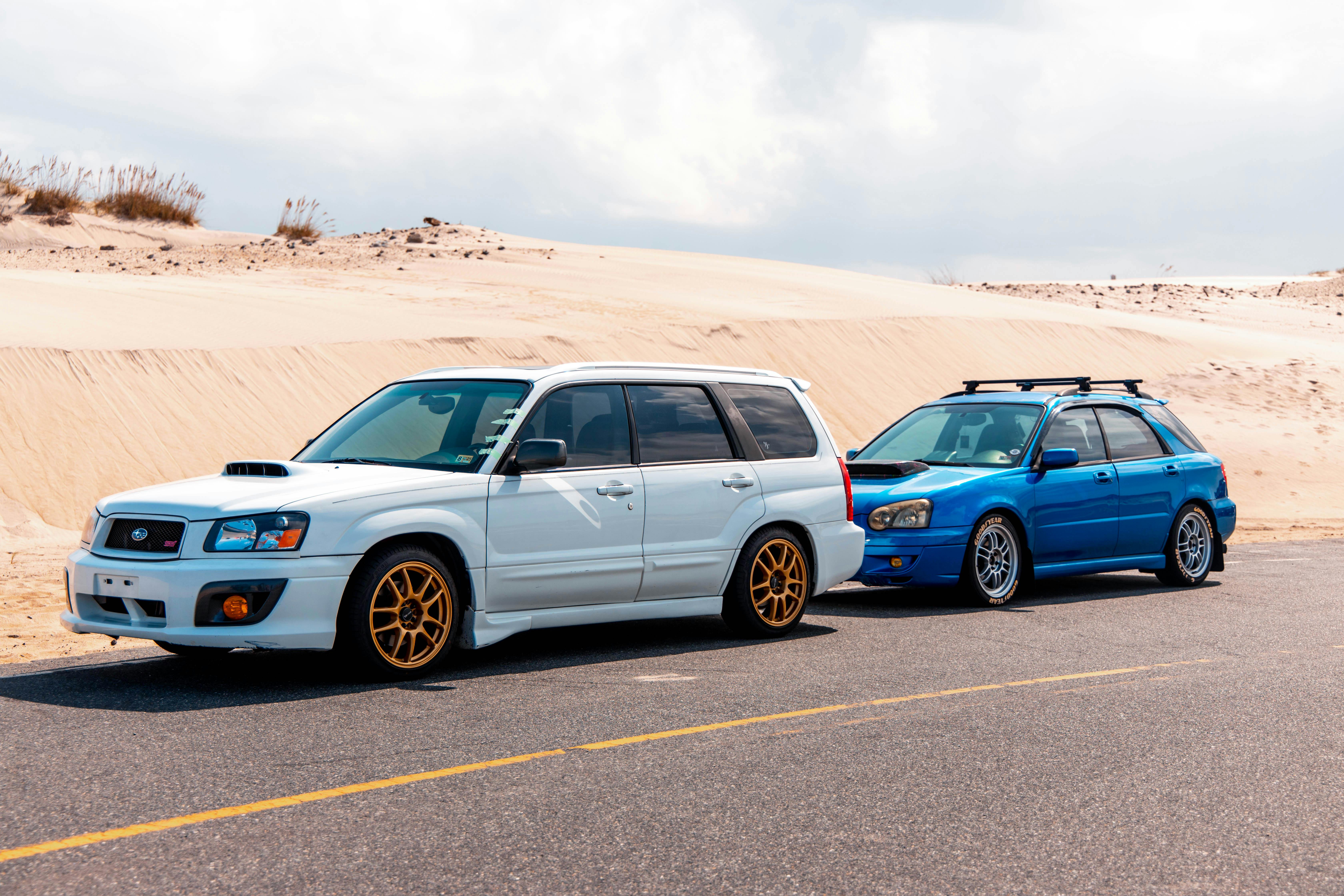 Sporty Subaru Cars in Desert Landscape · Free Stock Photo