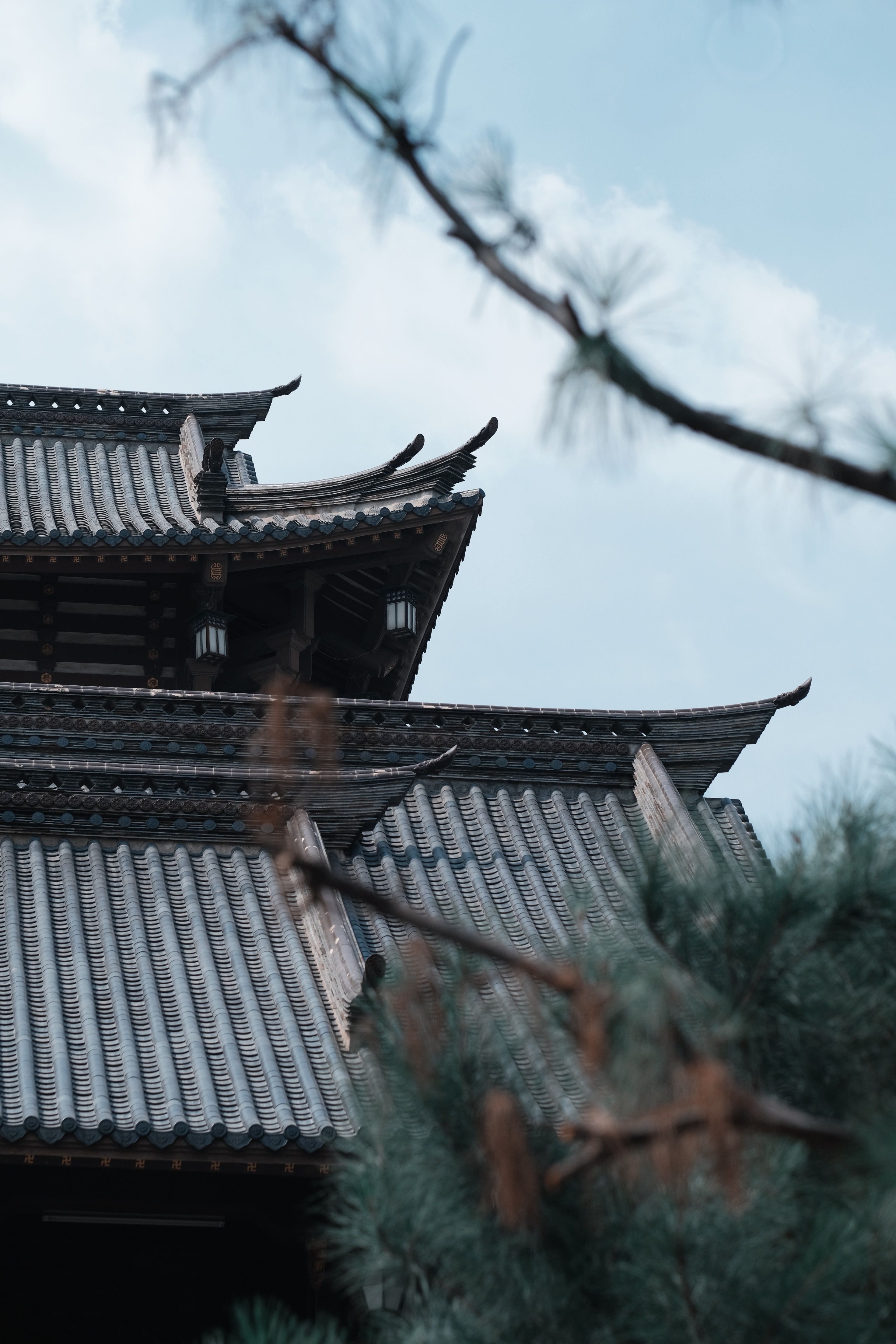 Traditional Japanese Temple Roof Against Sky · Free Stock Photo