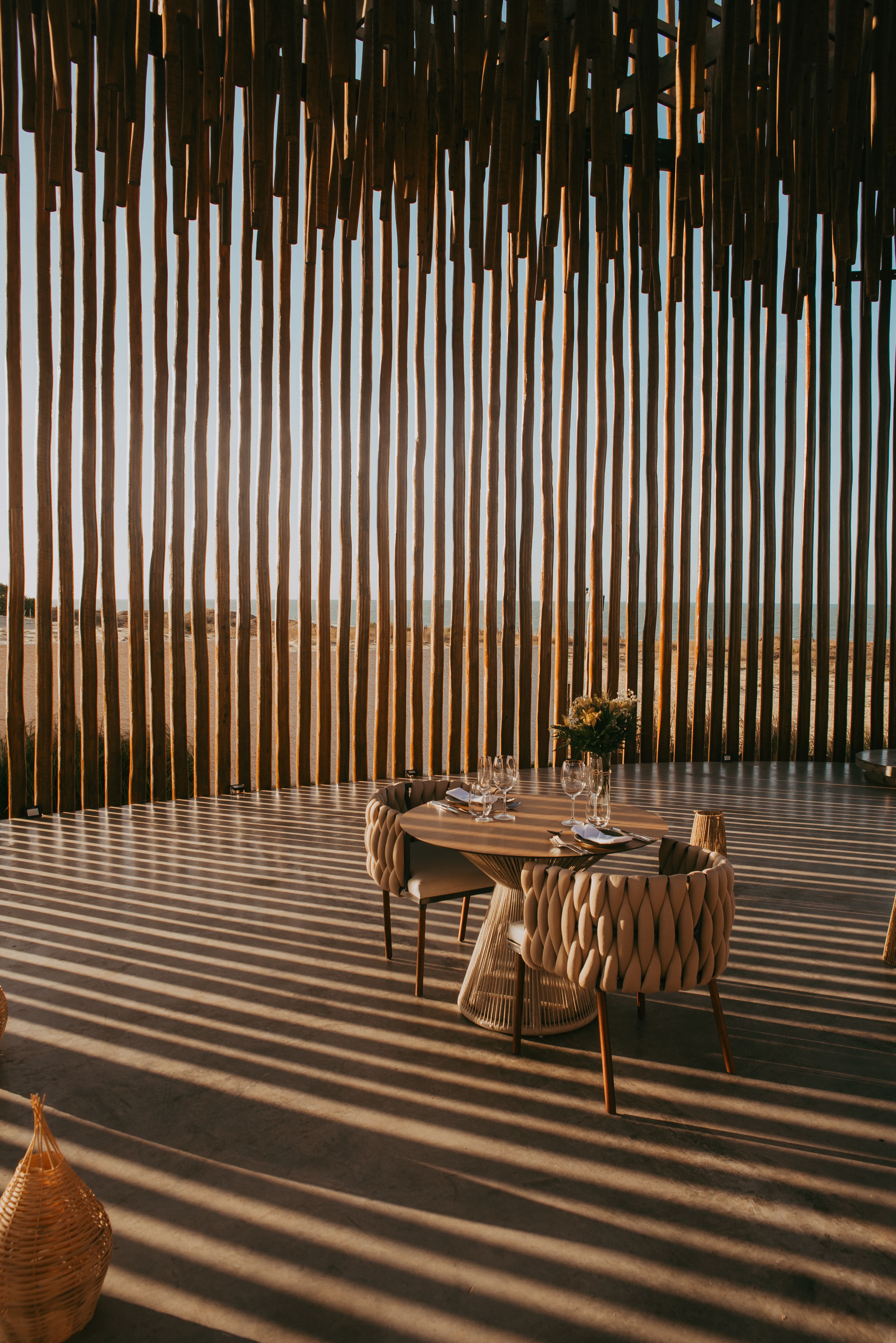 Elegant Outdoor Dining Setup with Sunset Shadows · Free Stock Photo