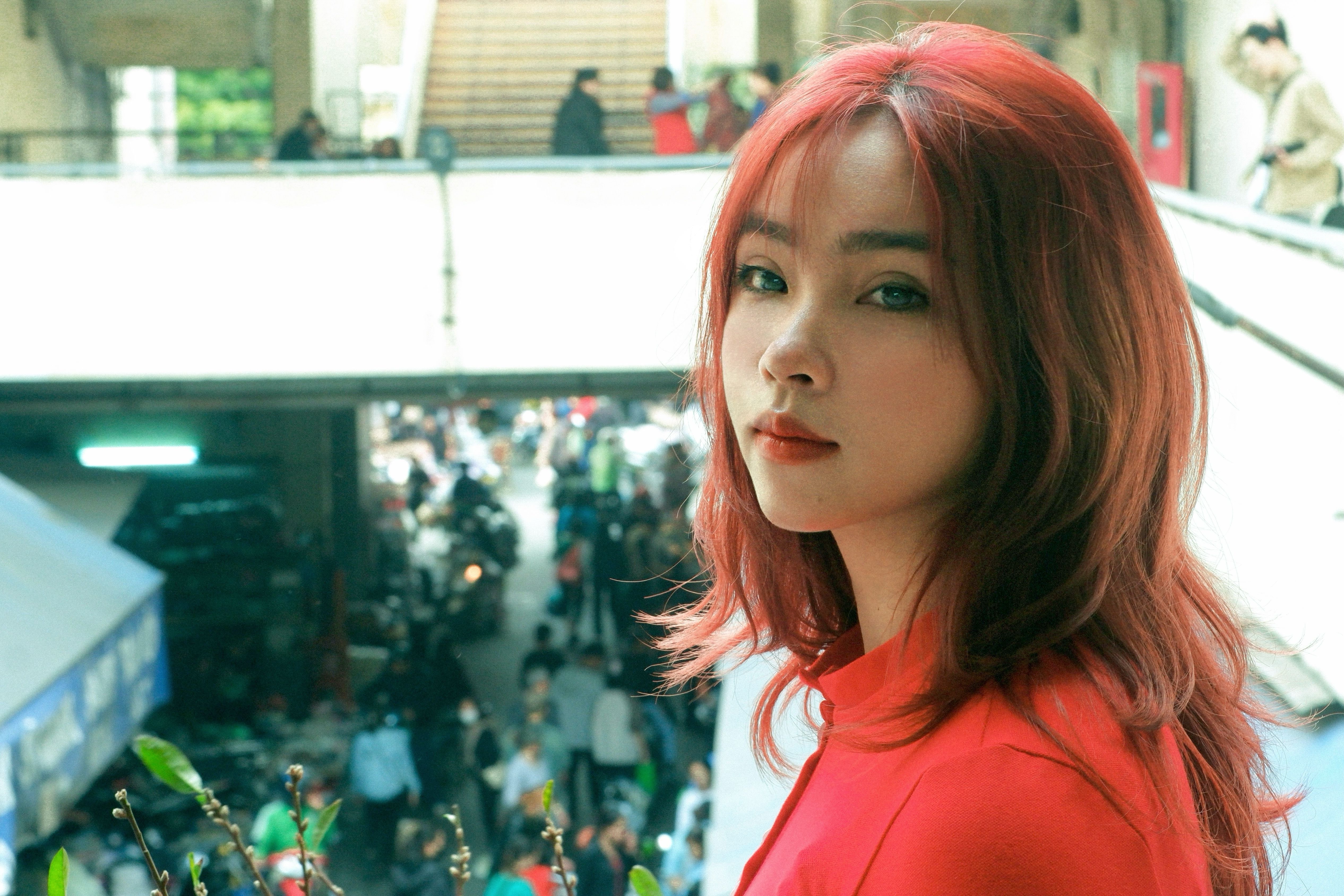 Portrait of a Young Woman in a Busy Urban Setting · Free Stock Photo
