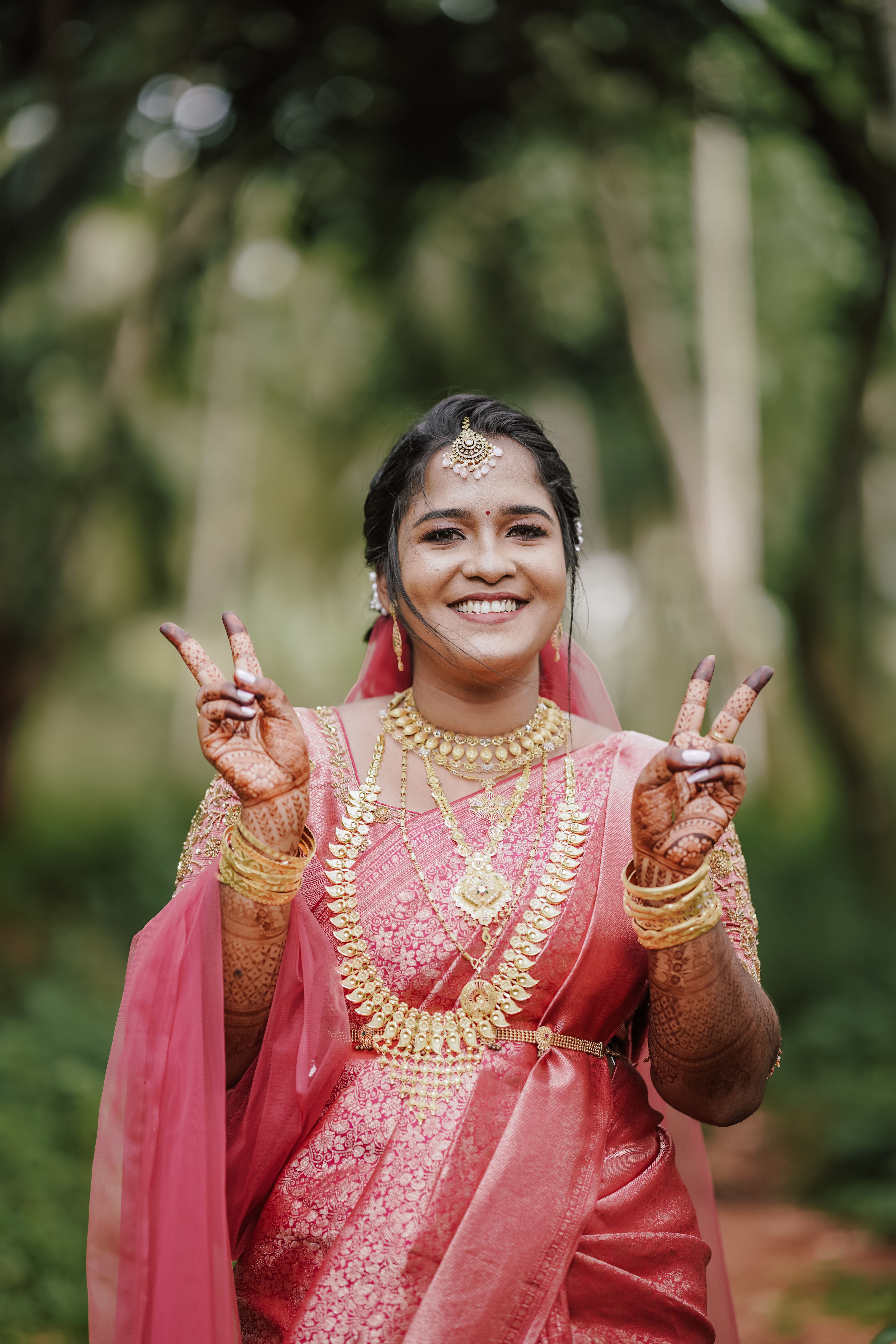 Smiling Indian Bride in Traditional Saree Outdoors · Free Stock Photo