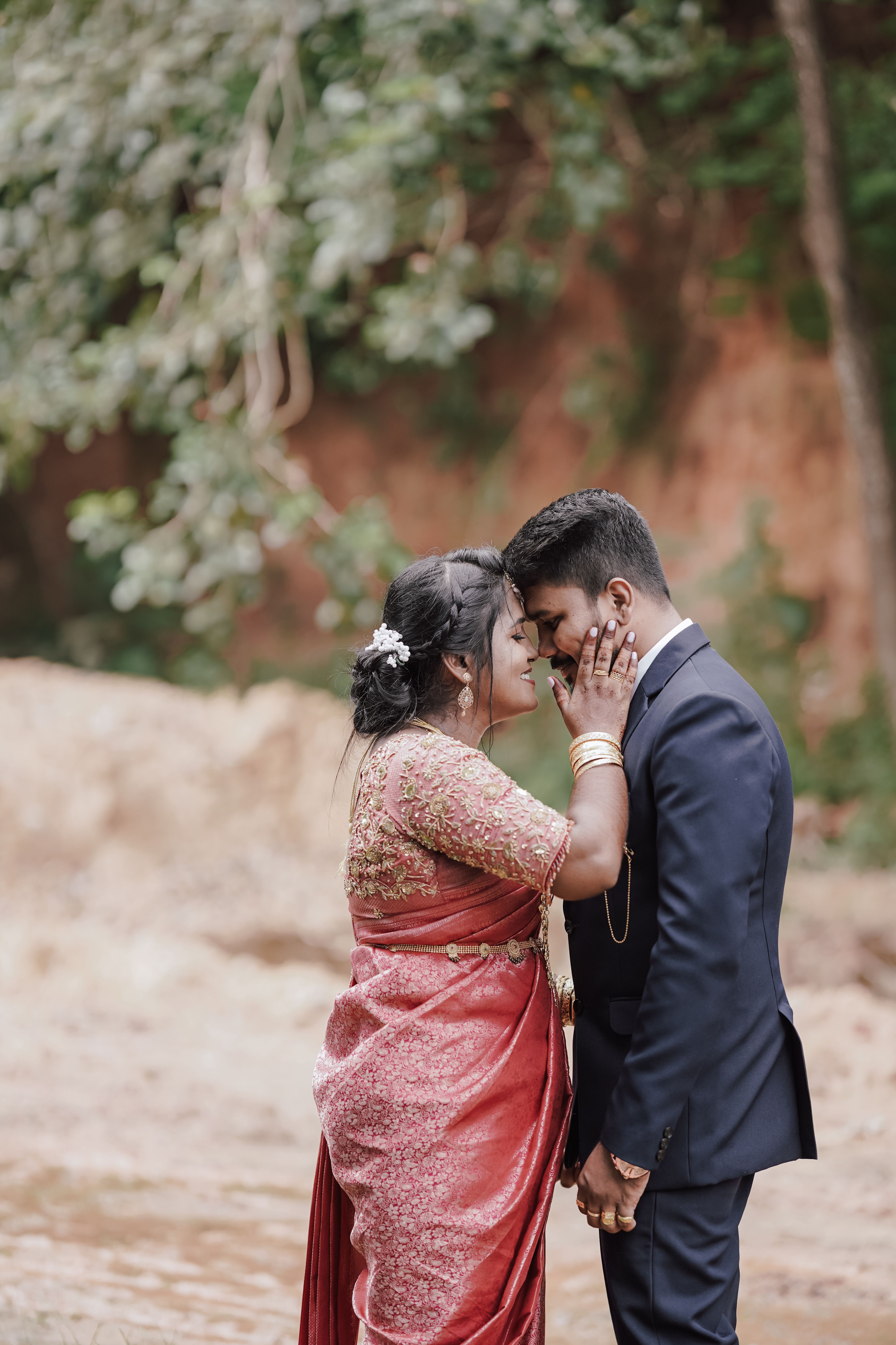 Romantic Couple Embracing in Traditional Indian Attire · Free Stock Photo
