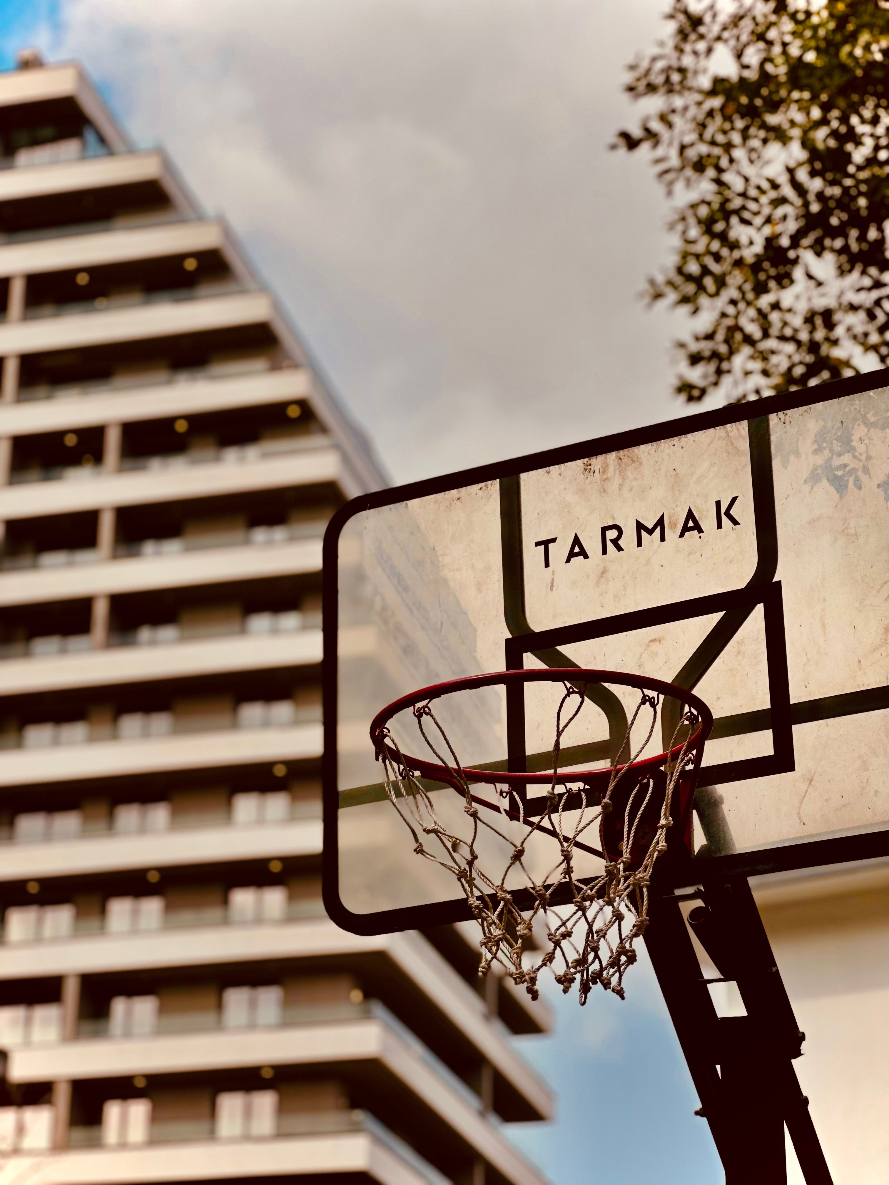Urban Basketball Hoop with Modern Architecture · Free Stock Photo