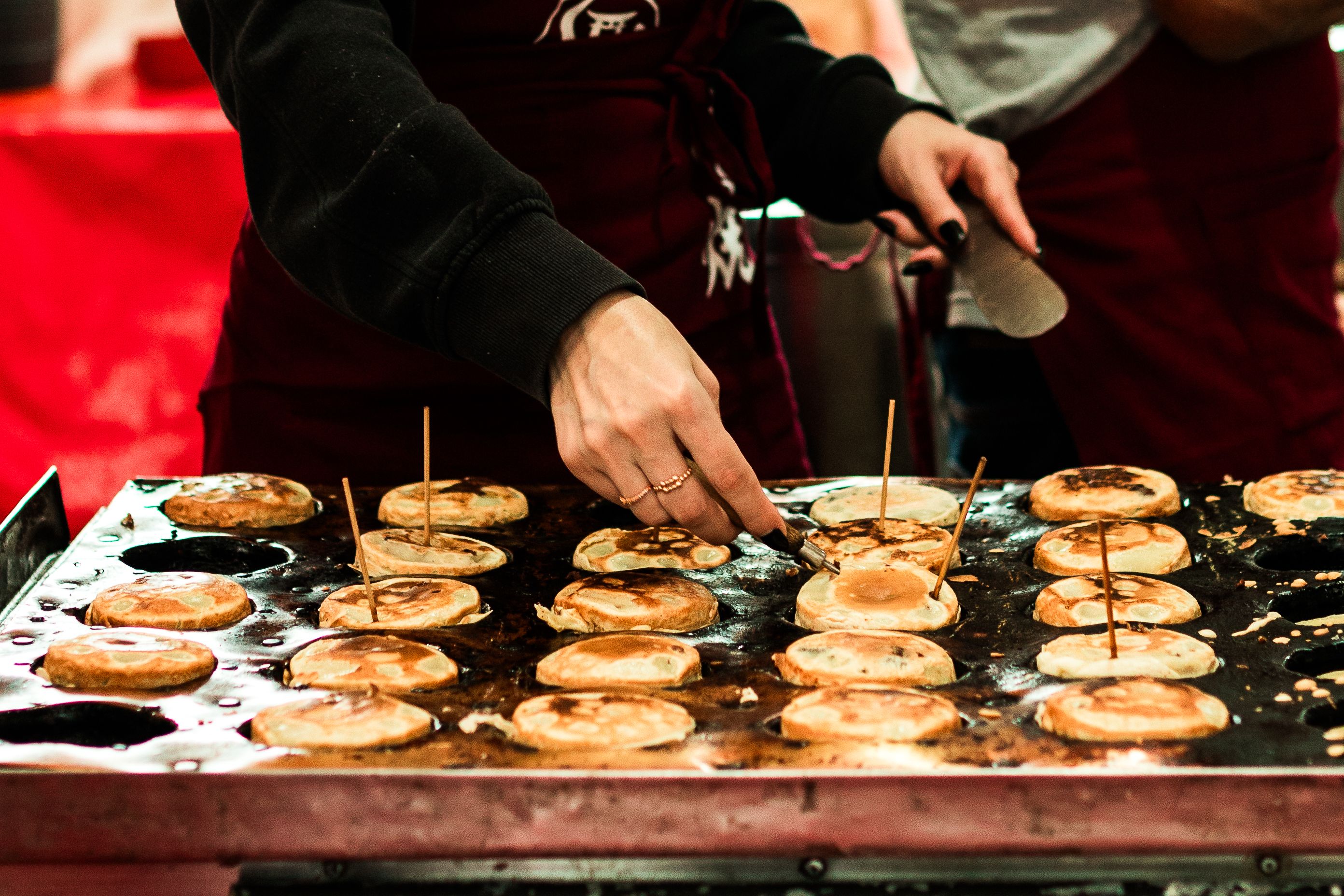 Street Food Vendor Cooking Delicious Pancakes · Free Stock Photo