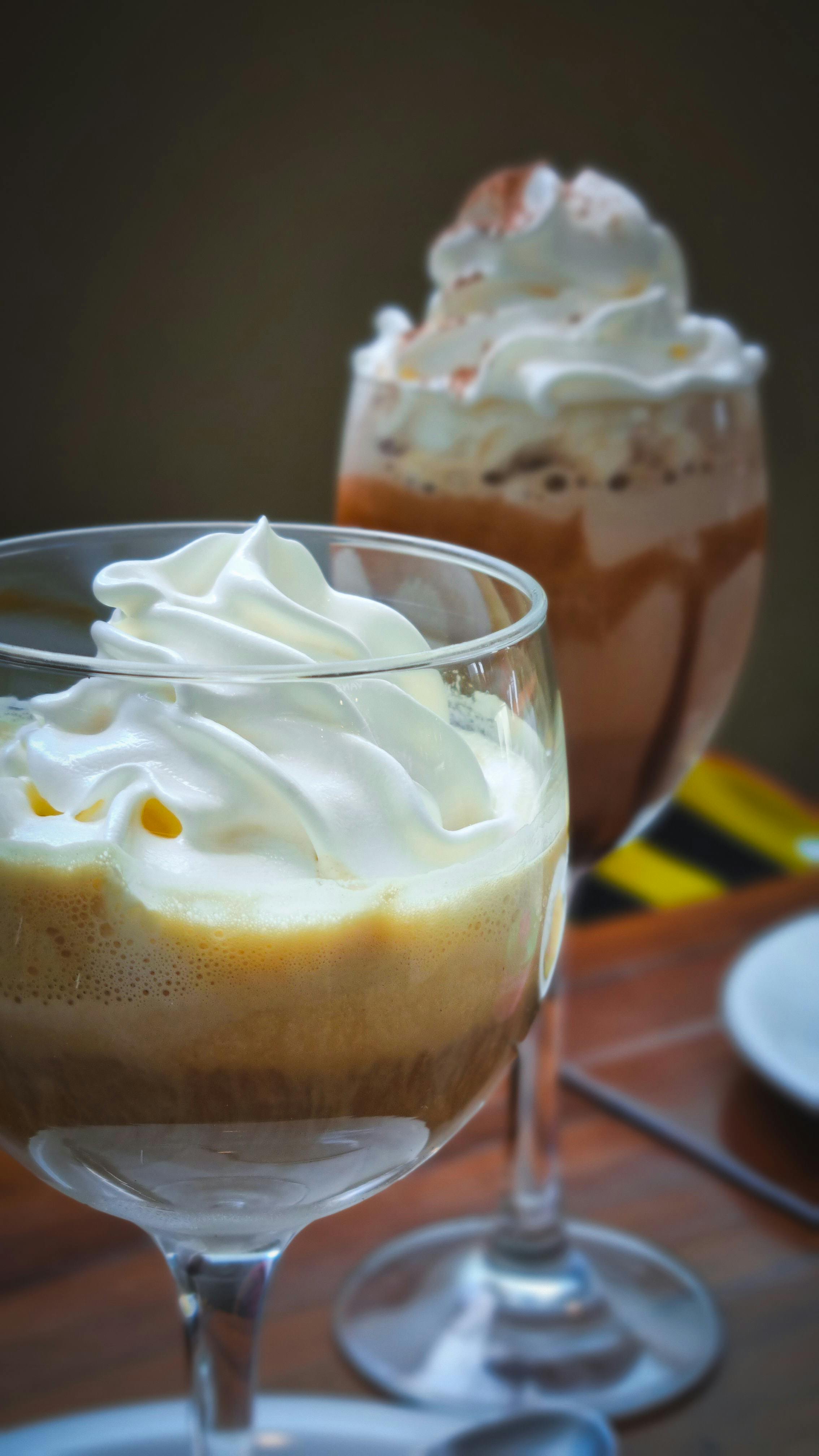 Delicious Dessert Beverages with Cream Topping · Free Stock Photo