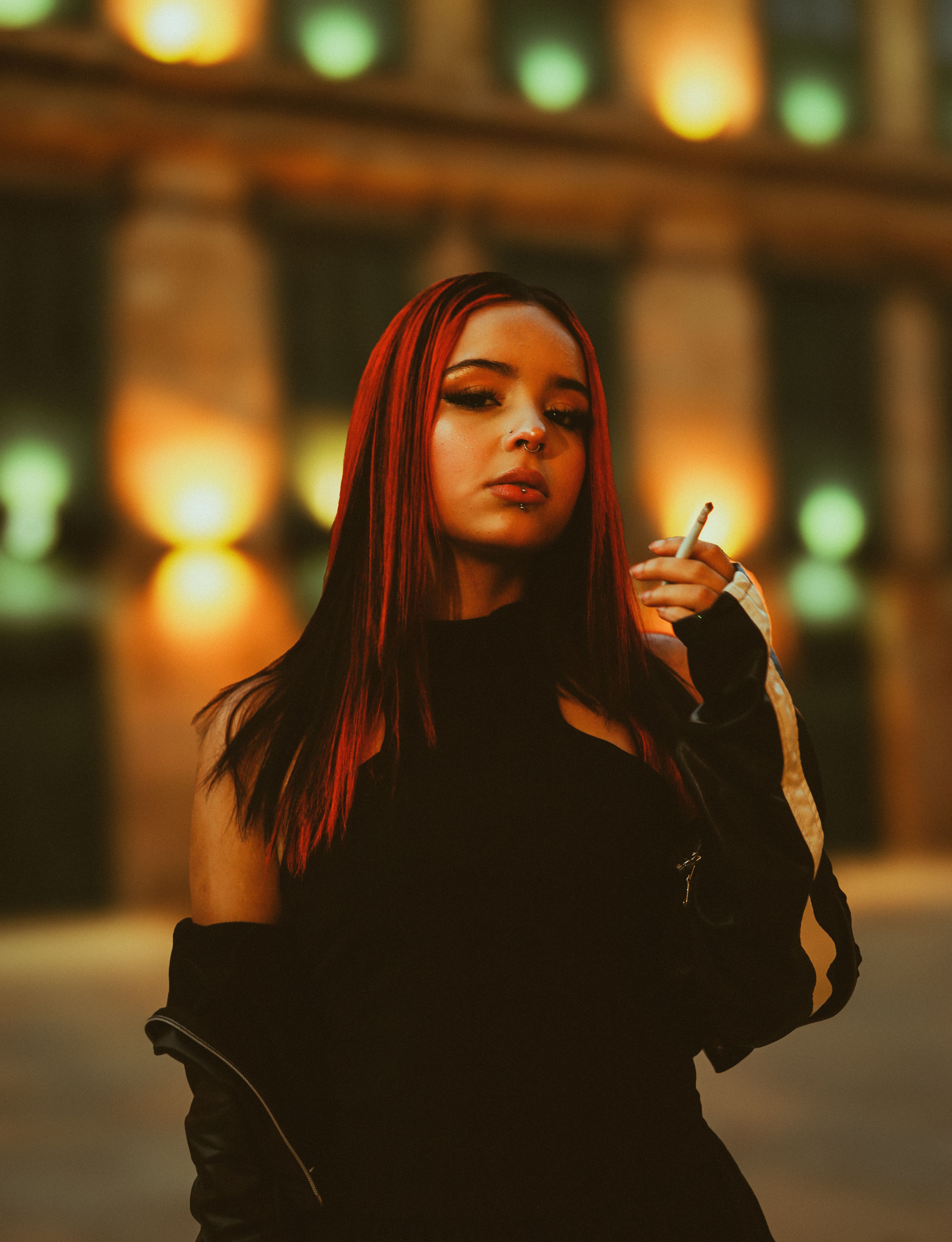 Stylish Woman Posing at Night in Urban Setting · Free Stock Photo
