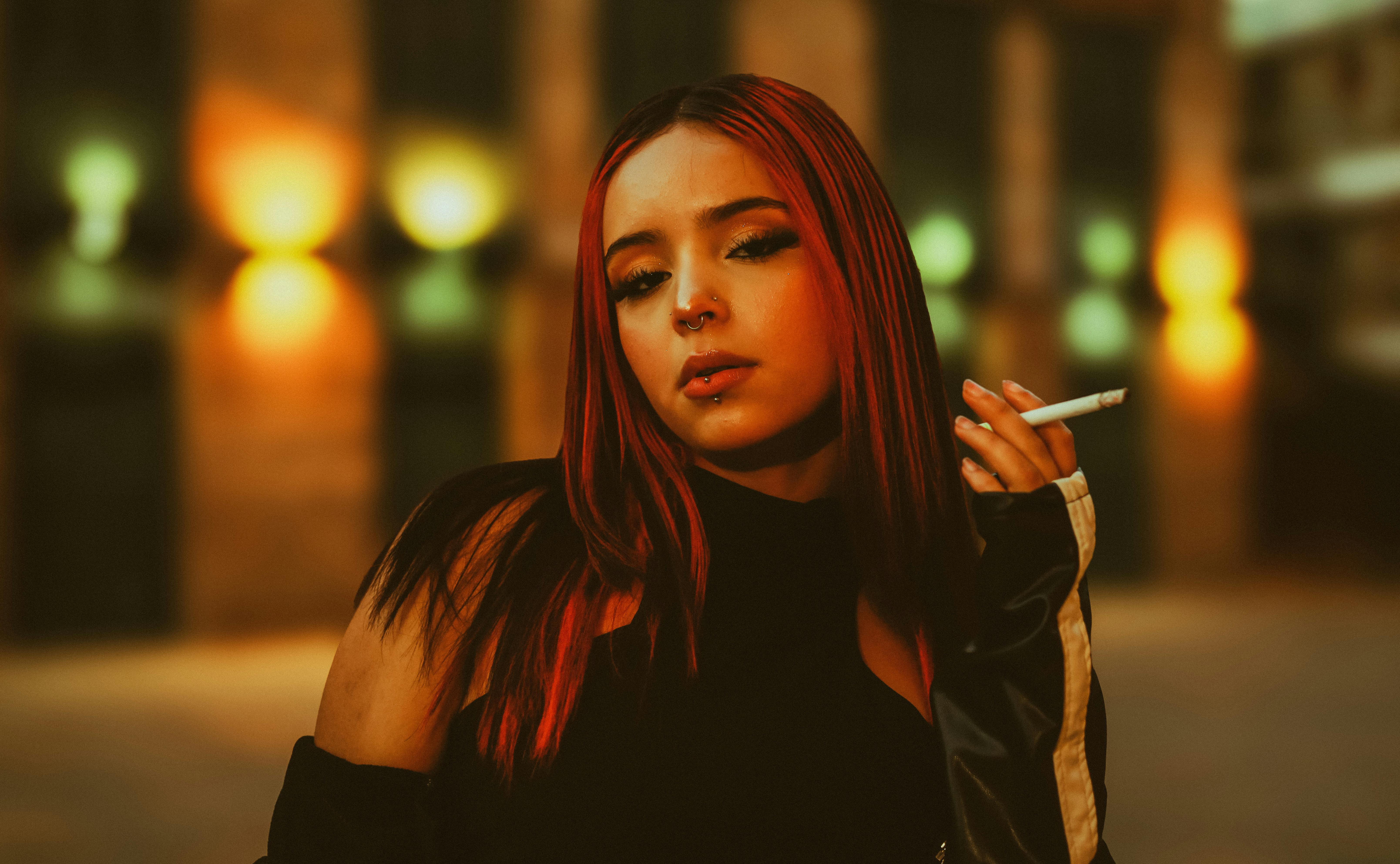 Young Woman with Red Hair Smoking at Night · Free Stock Photo