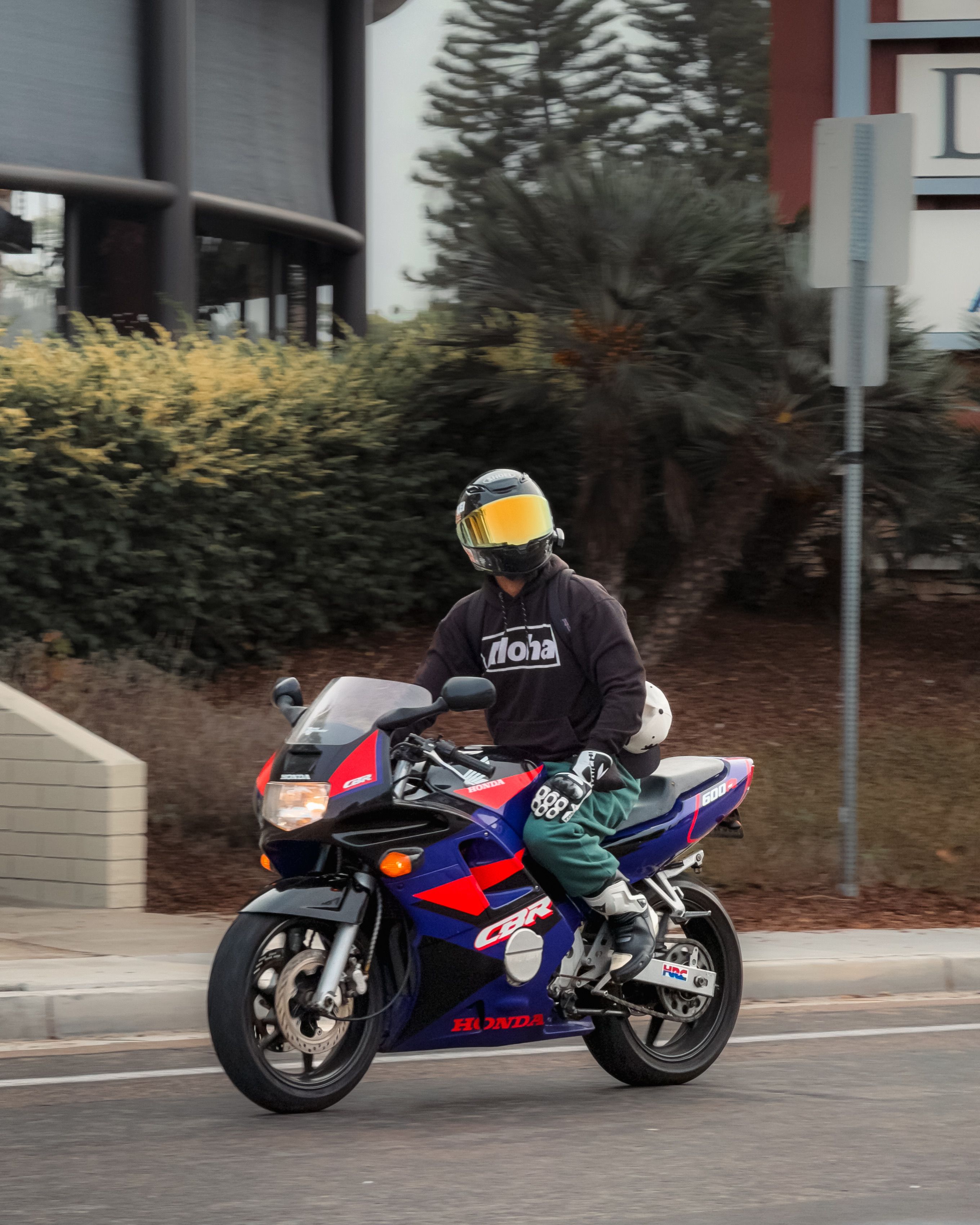 Motorcyclist Riding Sport Bike in Urban Setting · Free Stock Photo