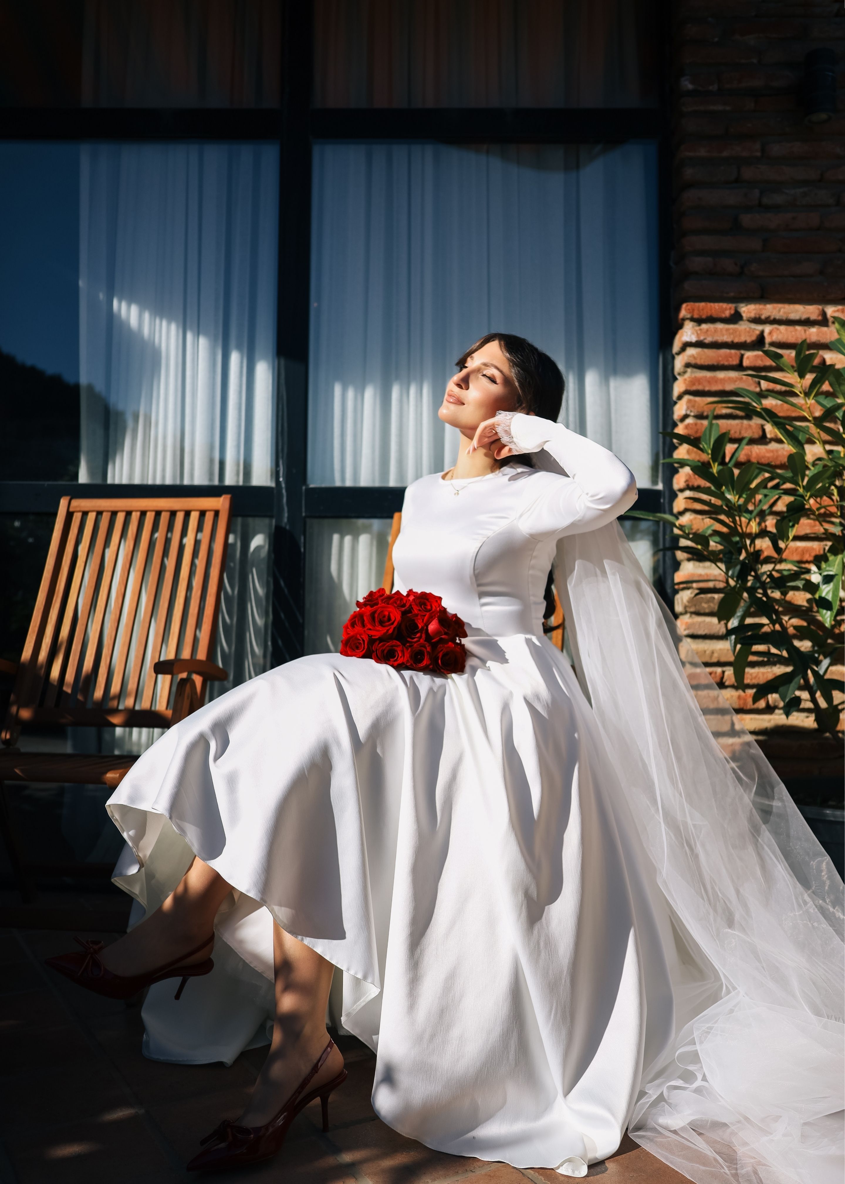 Radiant Bride in Elegant White Dress Relaxing Outdoors · Free Stock Photo