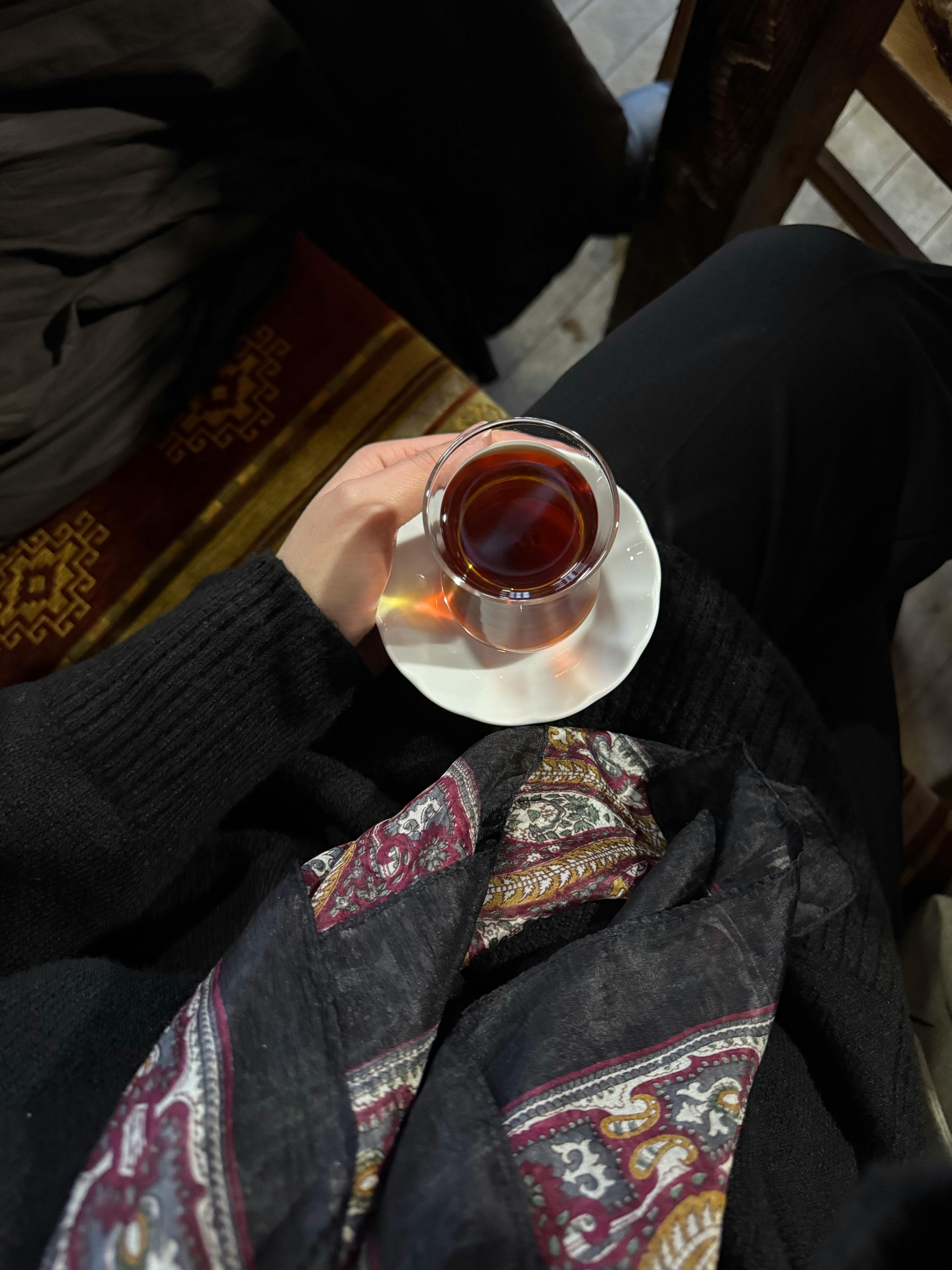 Cozy Indoor Scene with Person Holding Tea · Free Stock Photo