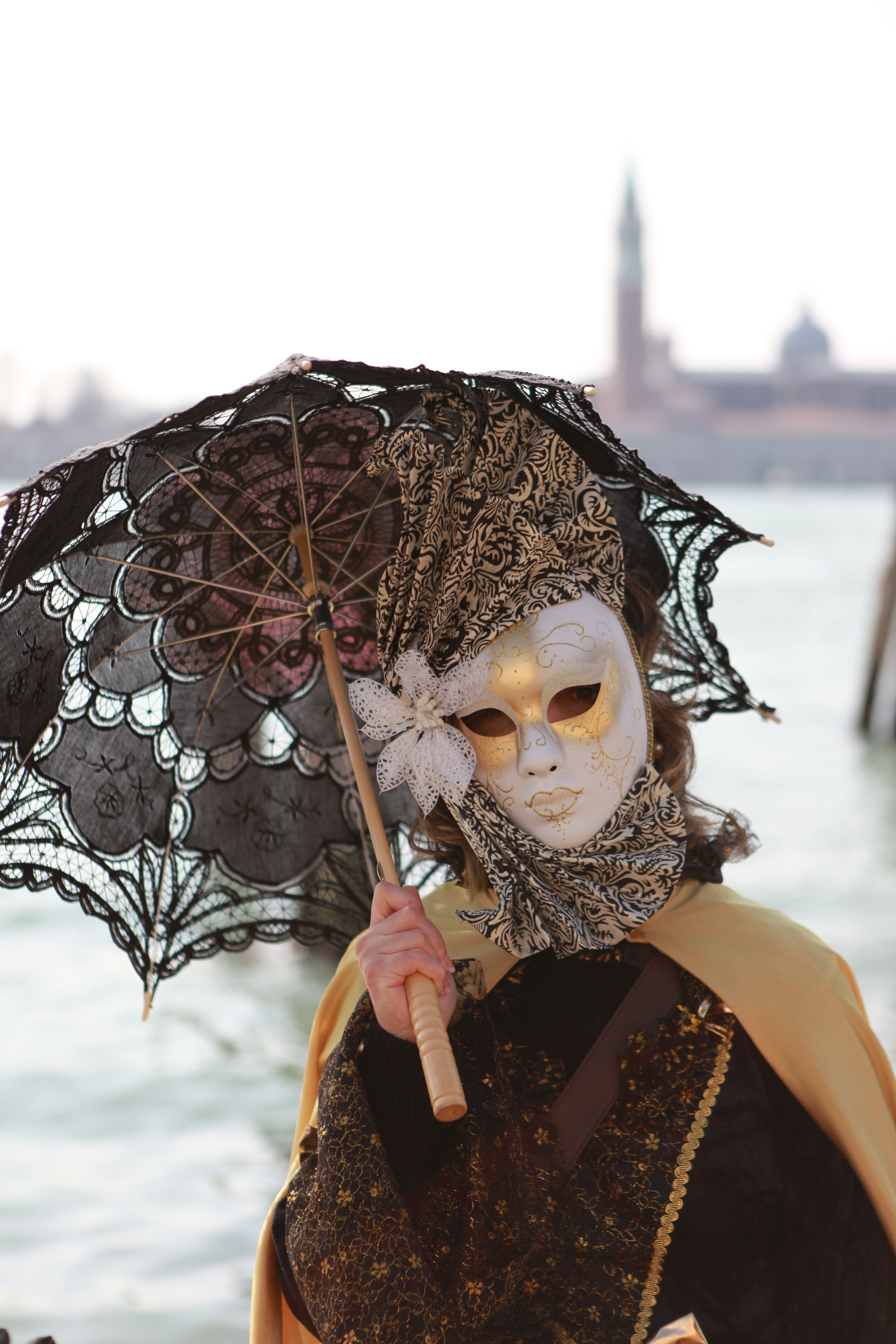 Masked Venetian Carnival Participant with Parasol · Free Stock Photo