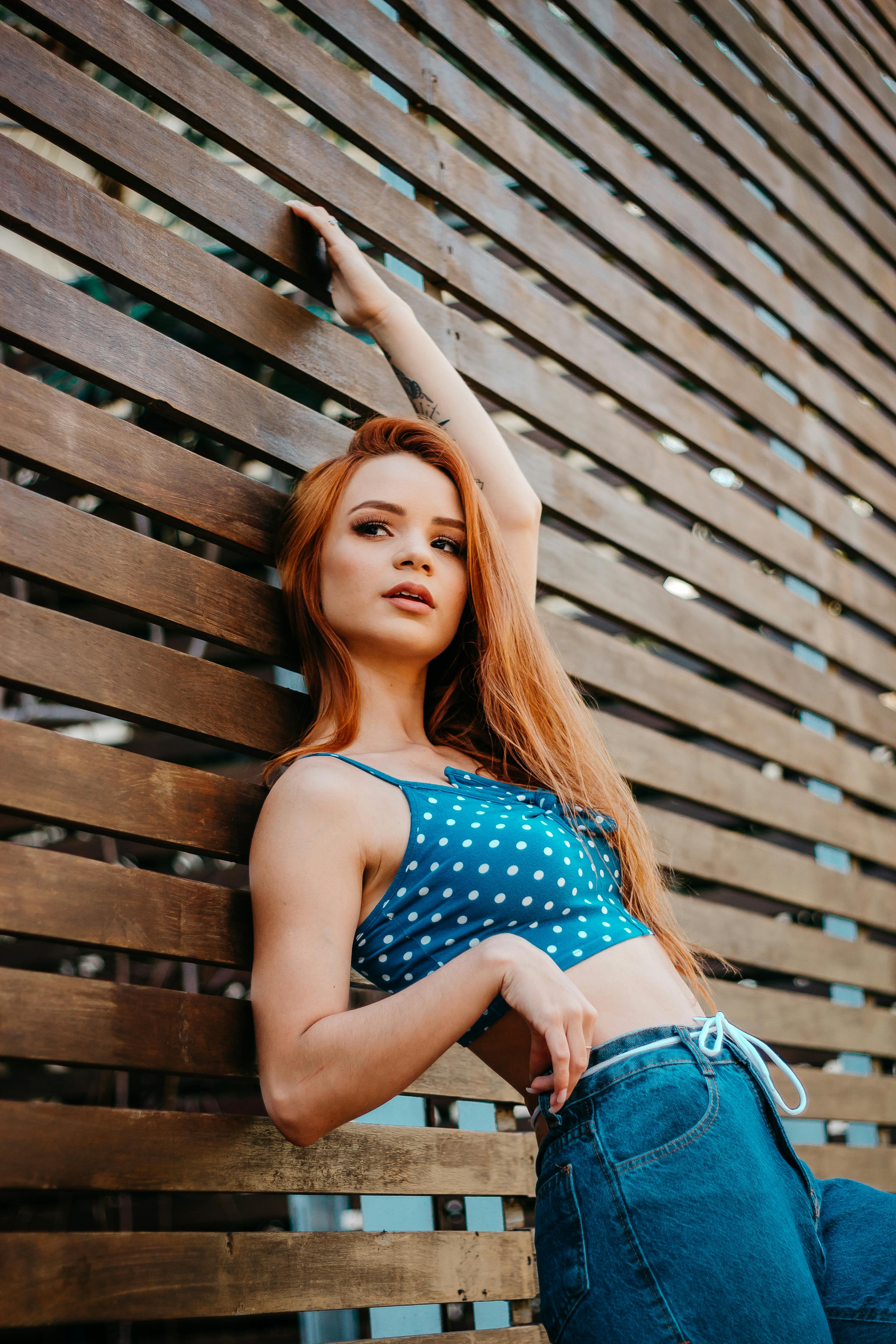 Photo Of Woman Leaning On Wall · Free Stock Photo