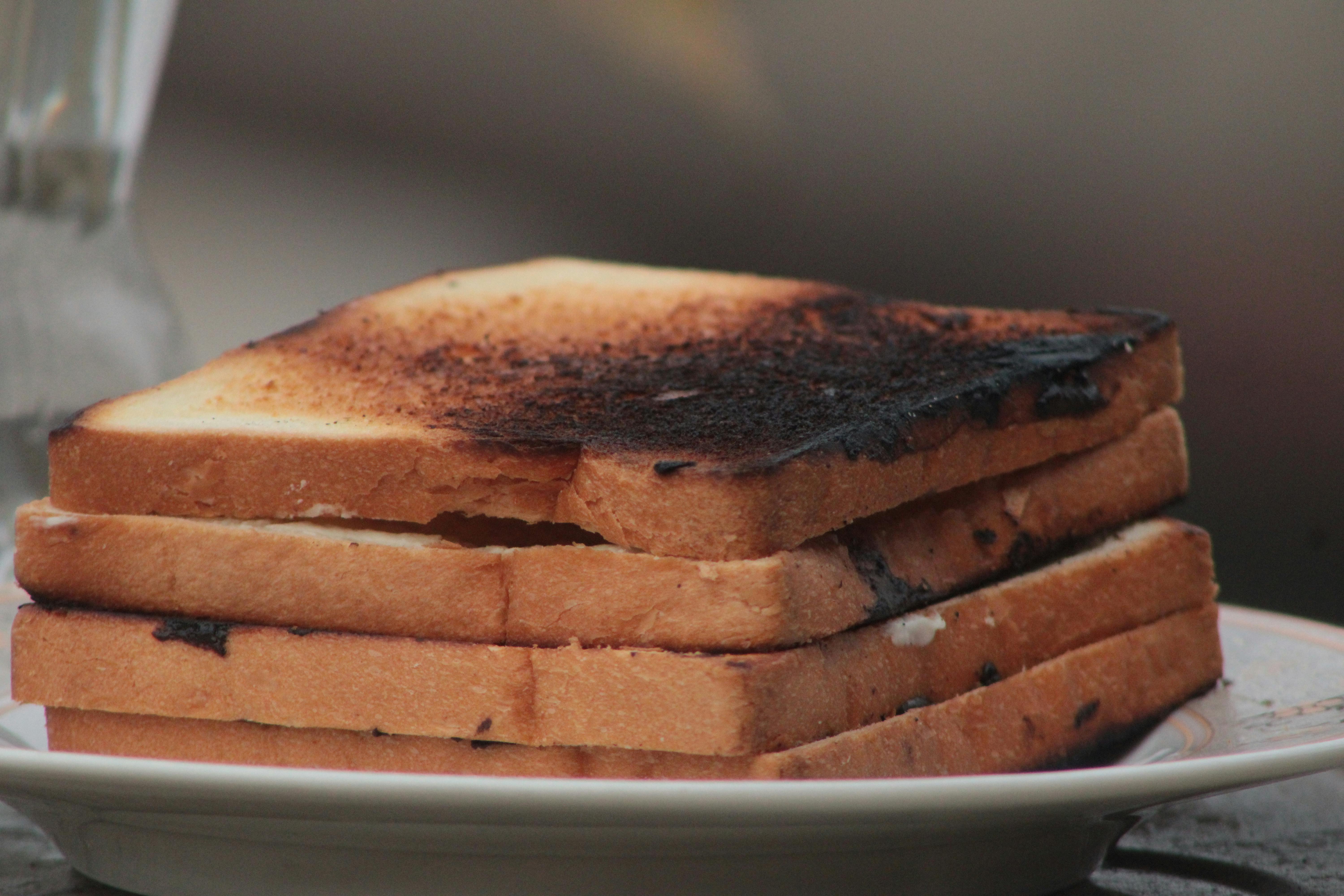 Stack of Burnt Toast on Plate Close-up · Free Stock Photo