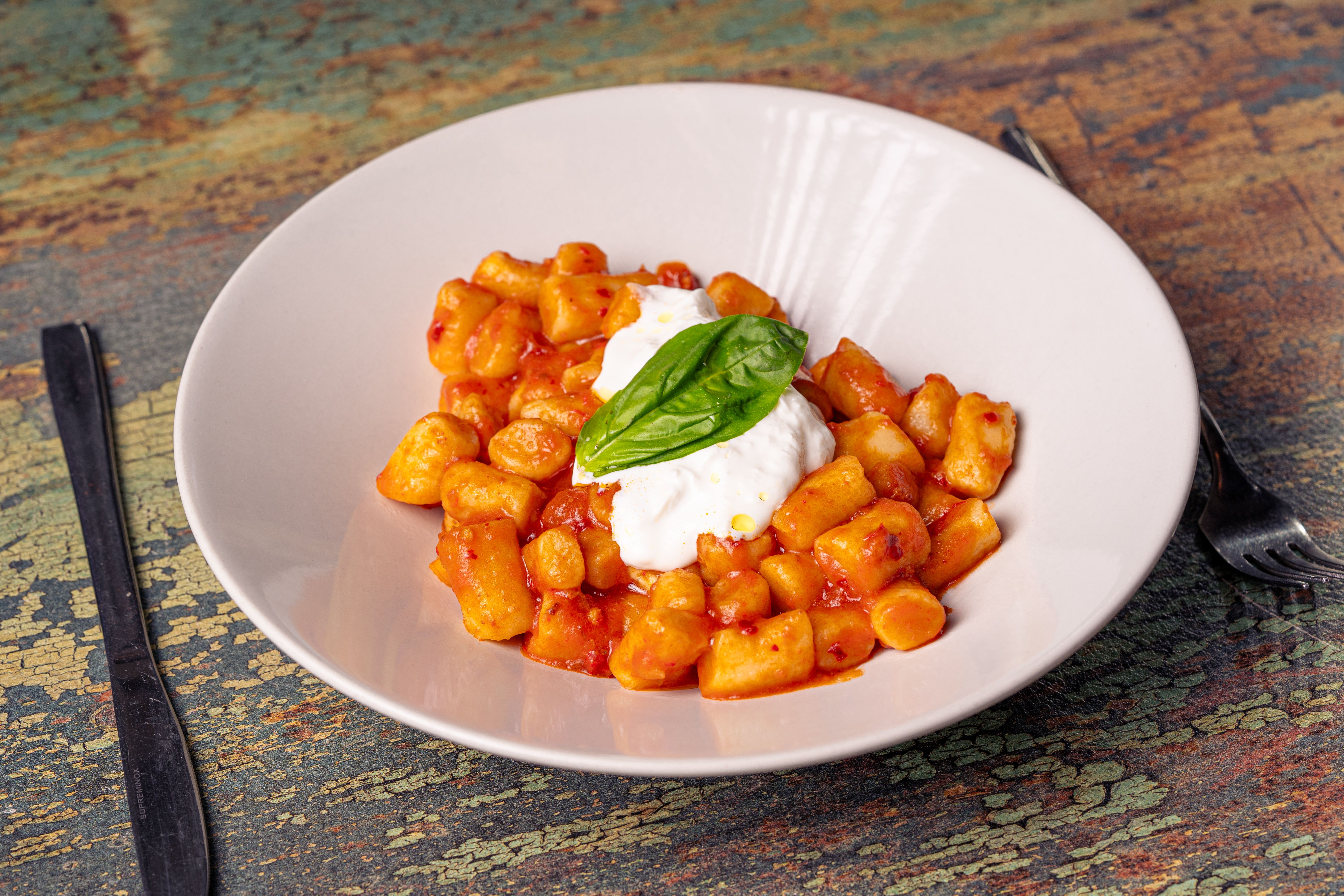 Plate of Gnocchi with Tomato Sauce and Basil · Free Stock Photo