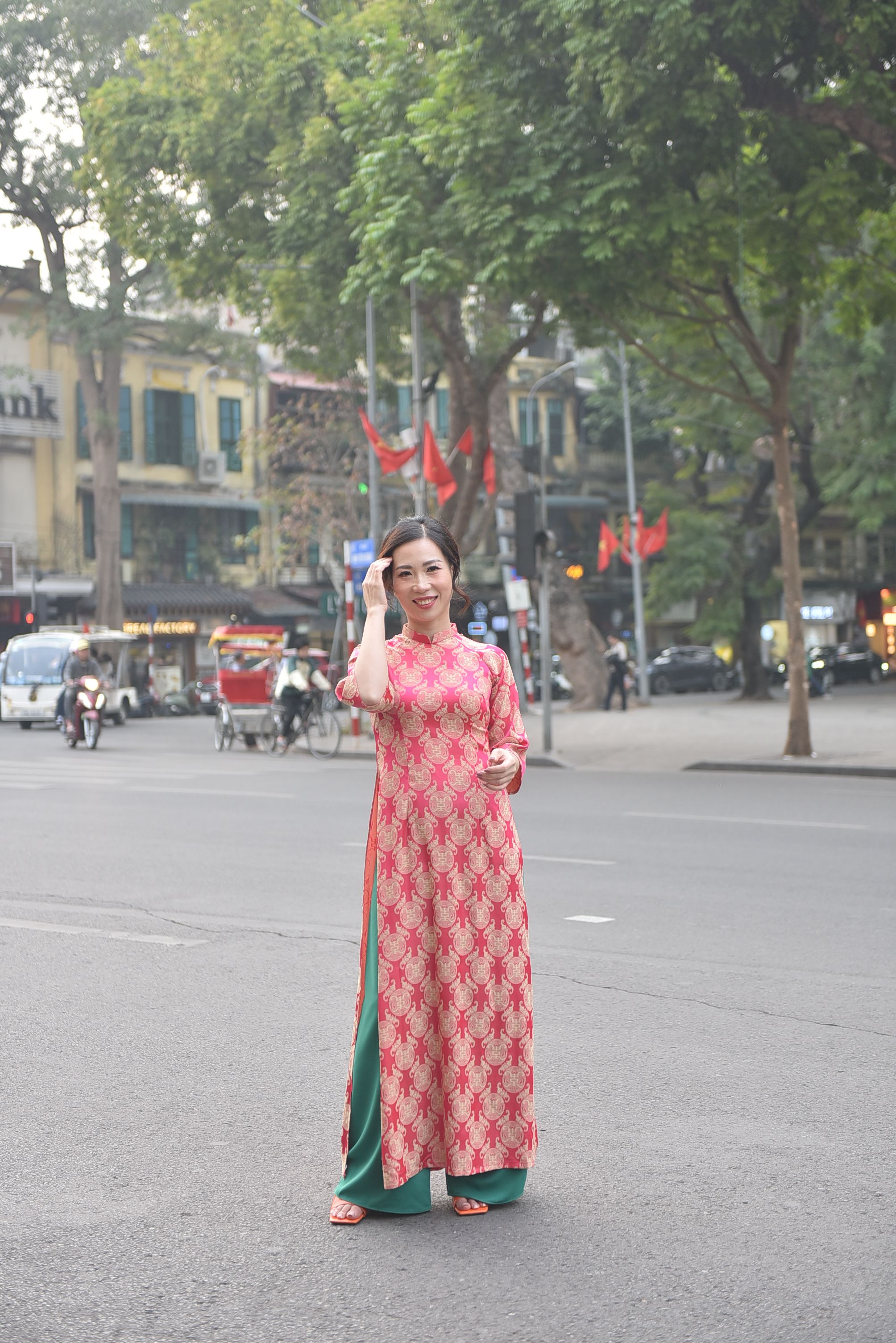 Woman in Traditional Dress on Hanoi Street · Free Stock Photo