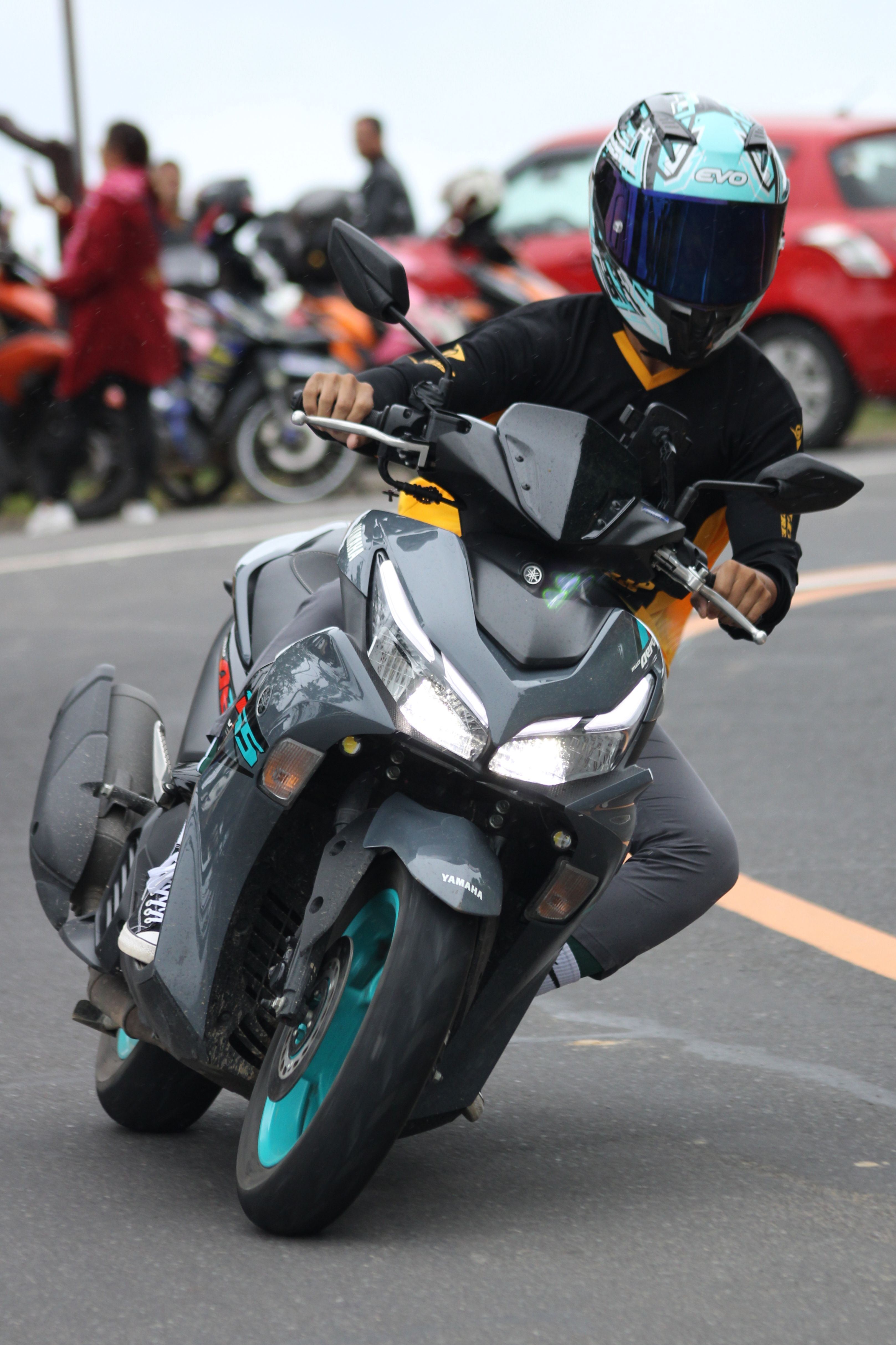 Dynamic Motorcycle Rider on Curved Road · Free Stock Photo