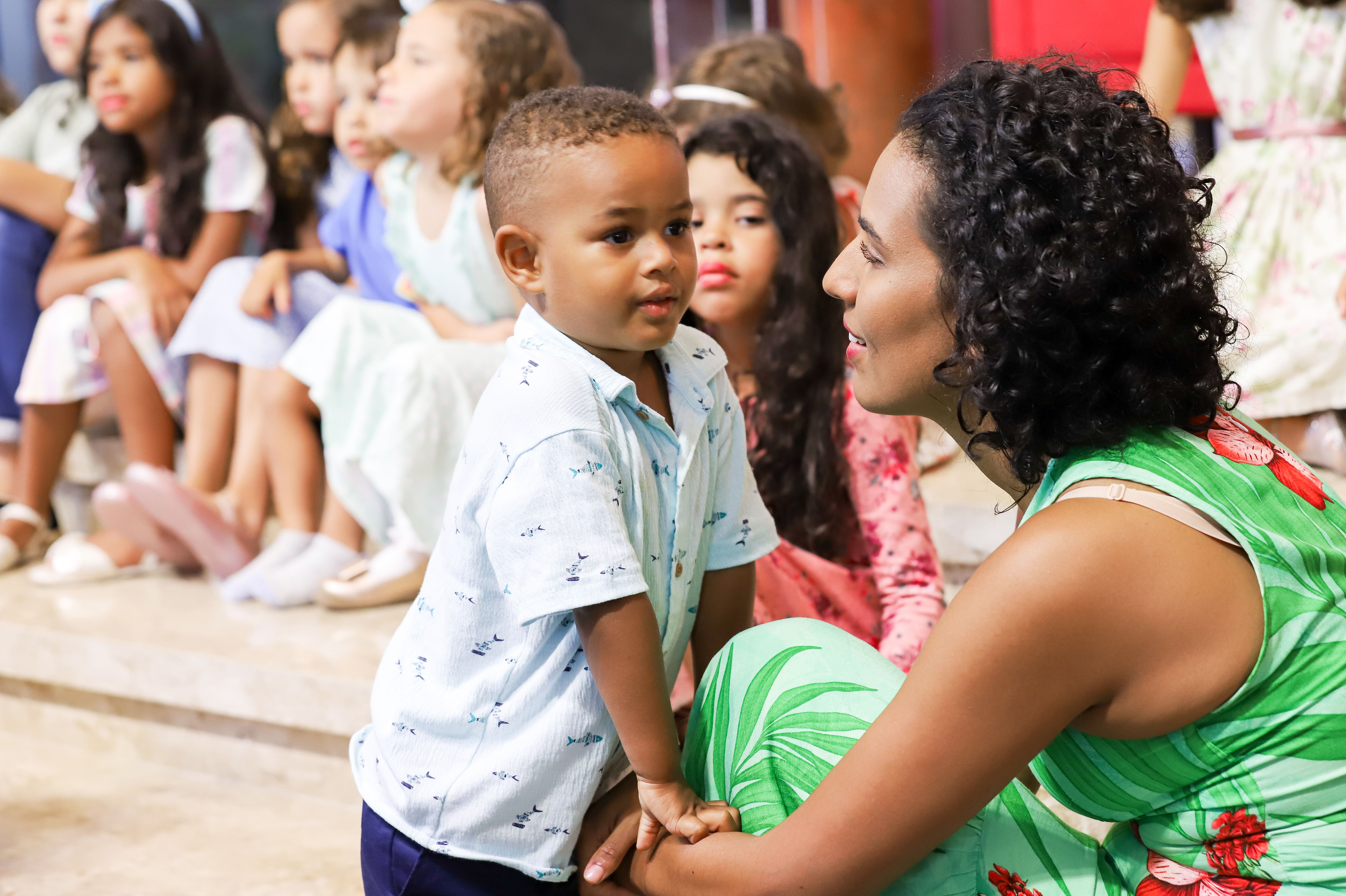 Mother and Child at a Colorful Gathering · Free Stock Photo