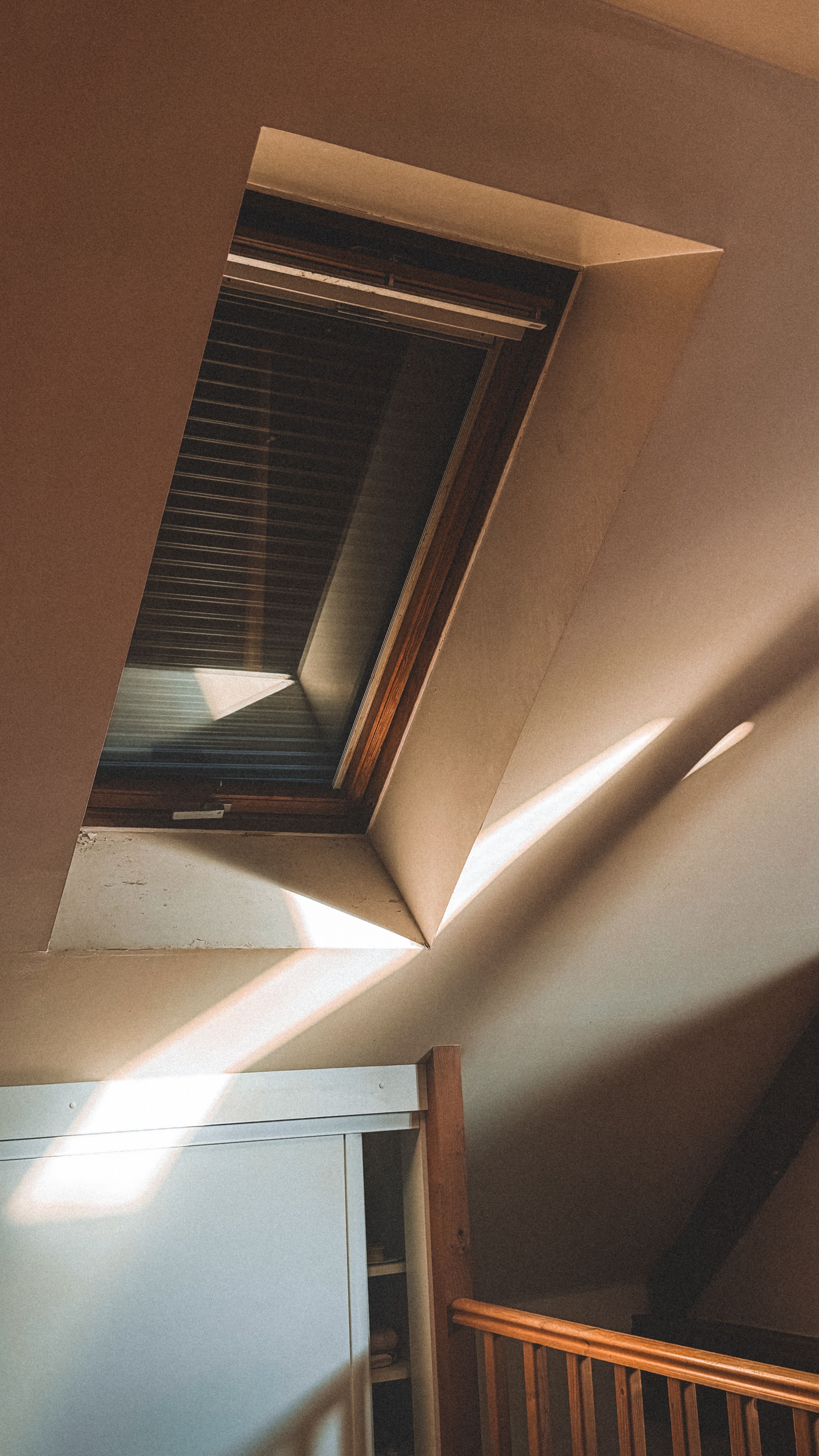 Sunlit Attic Window with Wooden Interior · Free Stock Photo