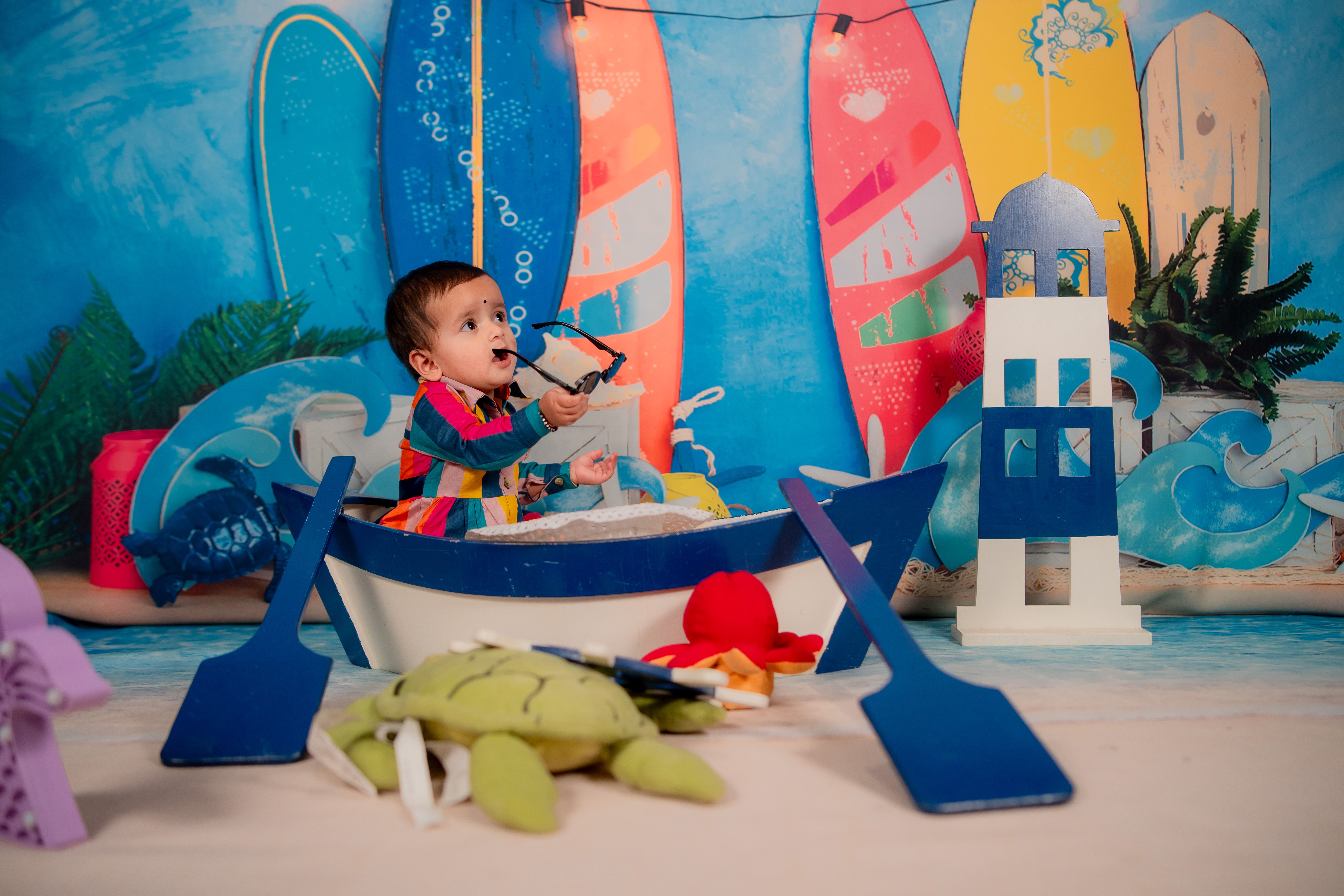 Playful nautical scene with child in boat · Free Stock Photo
