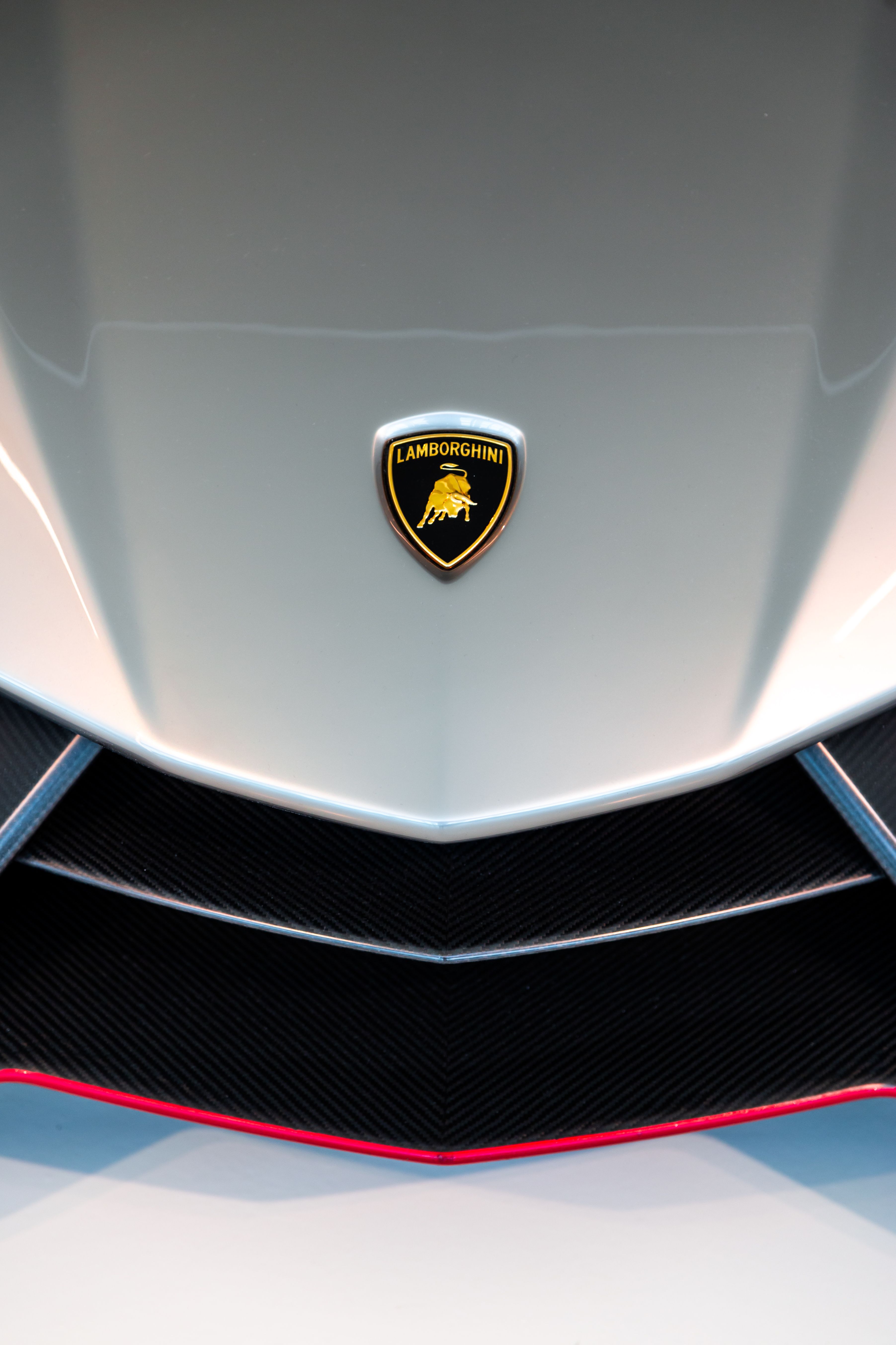 Sleek Lamborghini Sports Car Hood Close-Up · Free Stock Photo