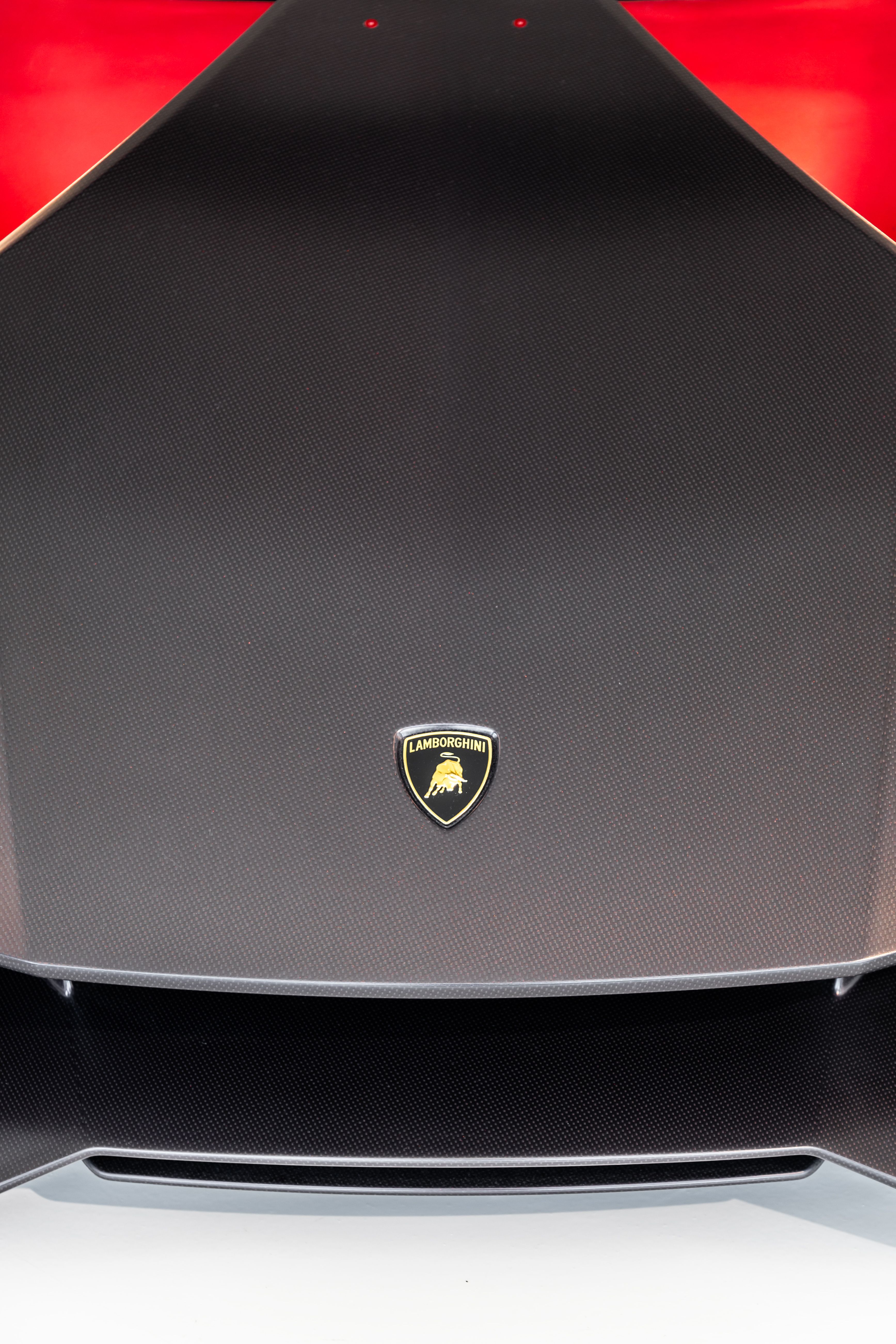 Lamborghini Car Hood with Red Background · Free Stock Photo