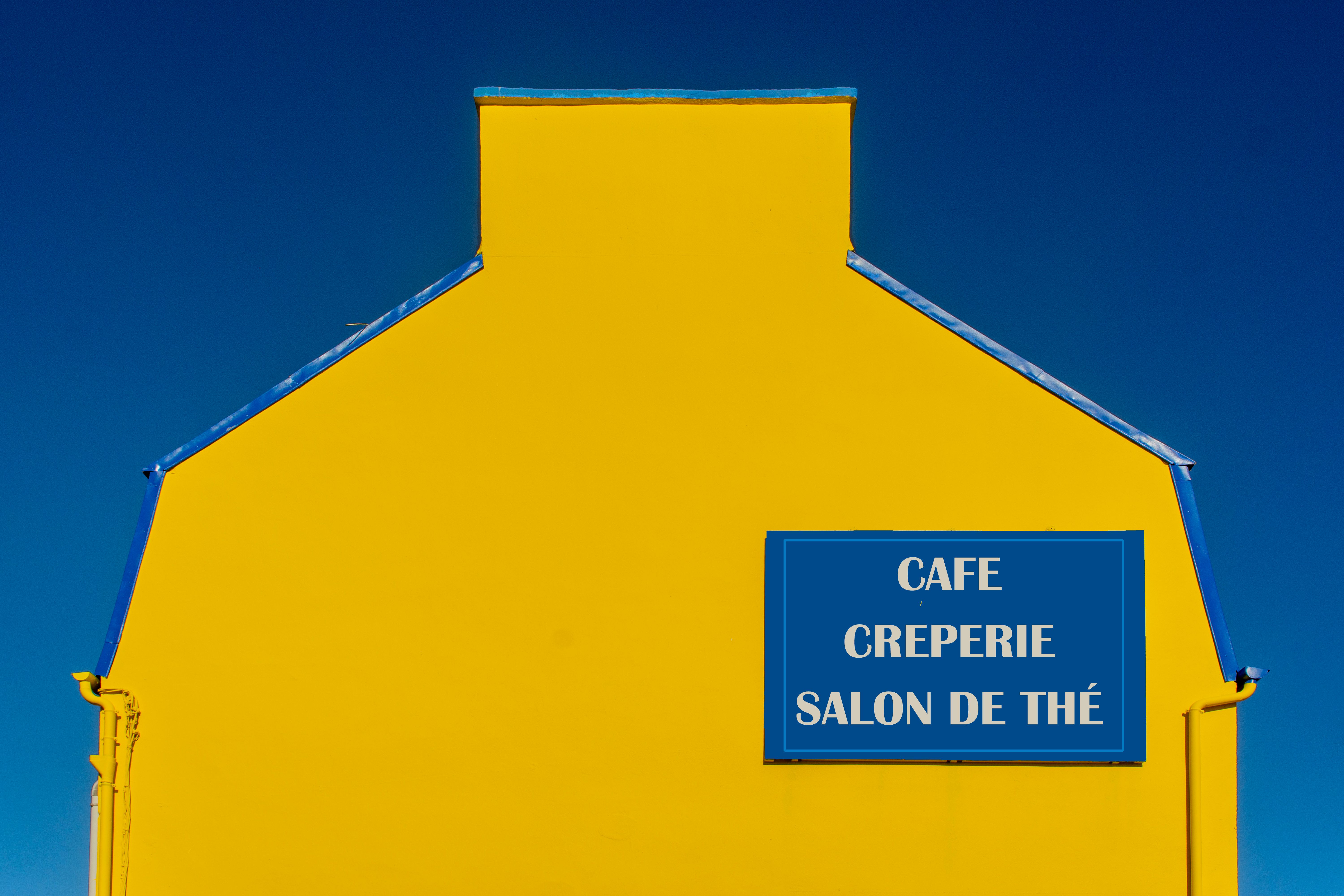 Sign of Coffee Shop on Ancient Building · Free Stock Photo