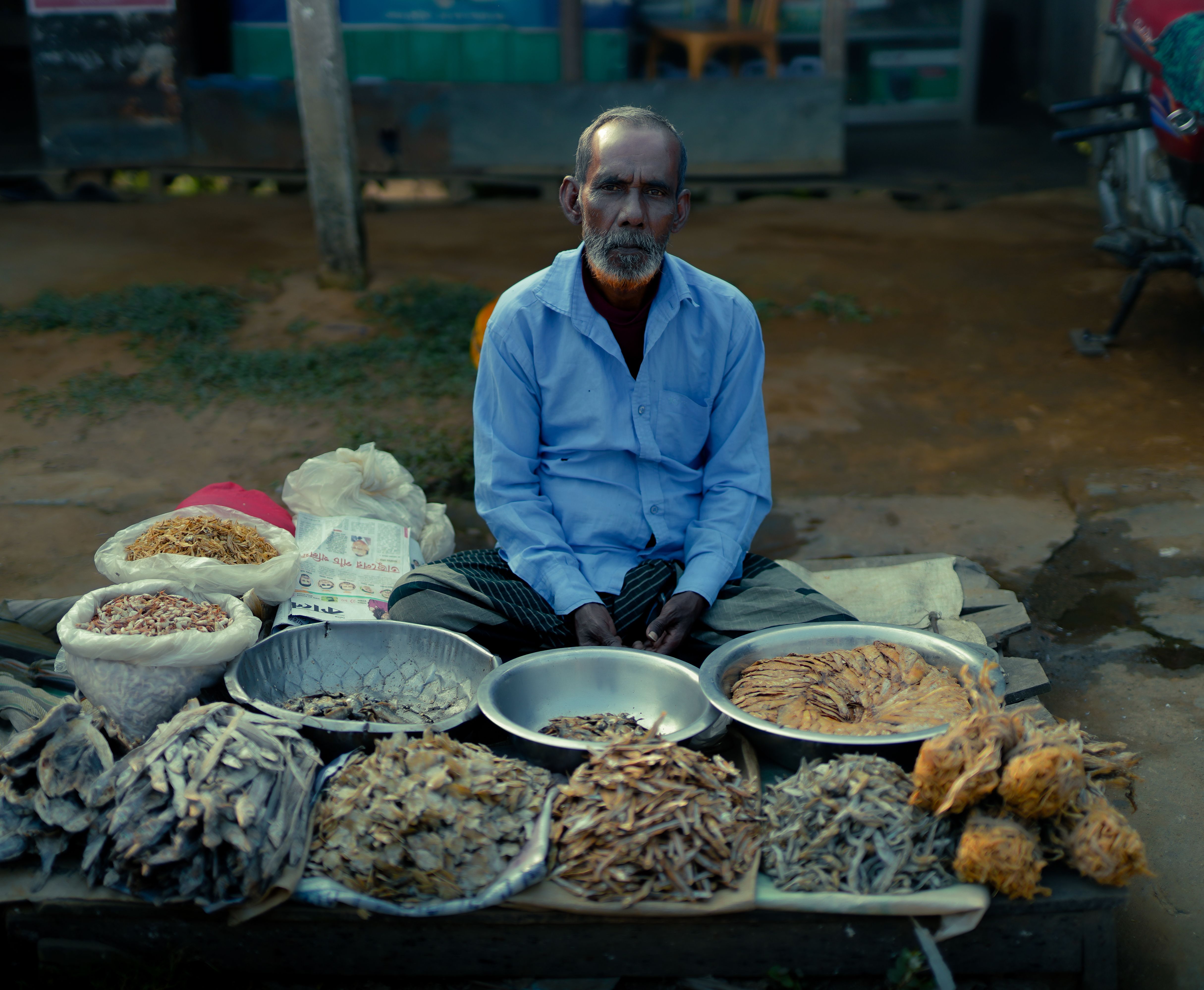 Bangladeshi Vendor Selling Dried Fish at Market · Free Stock Photo