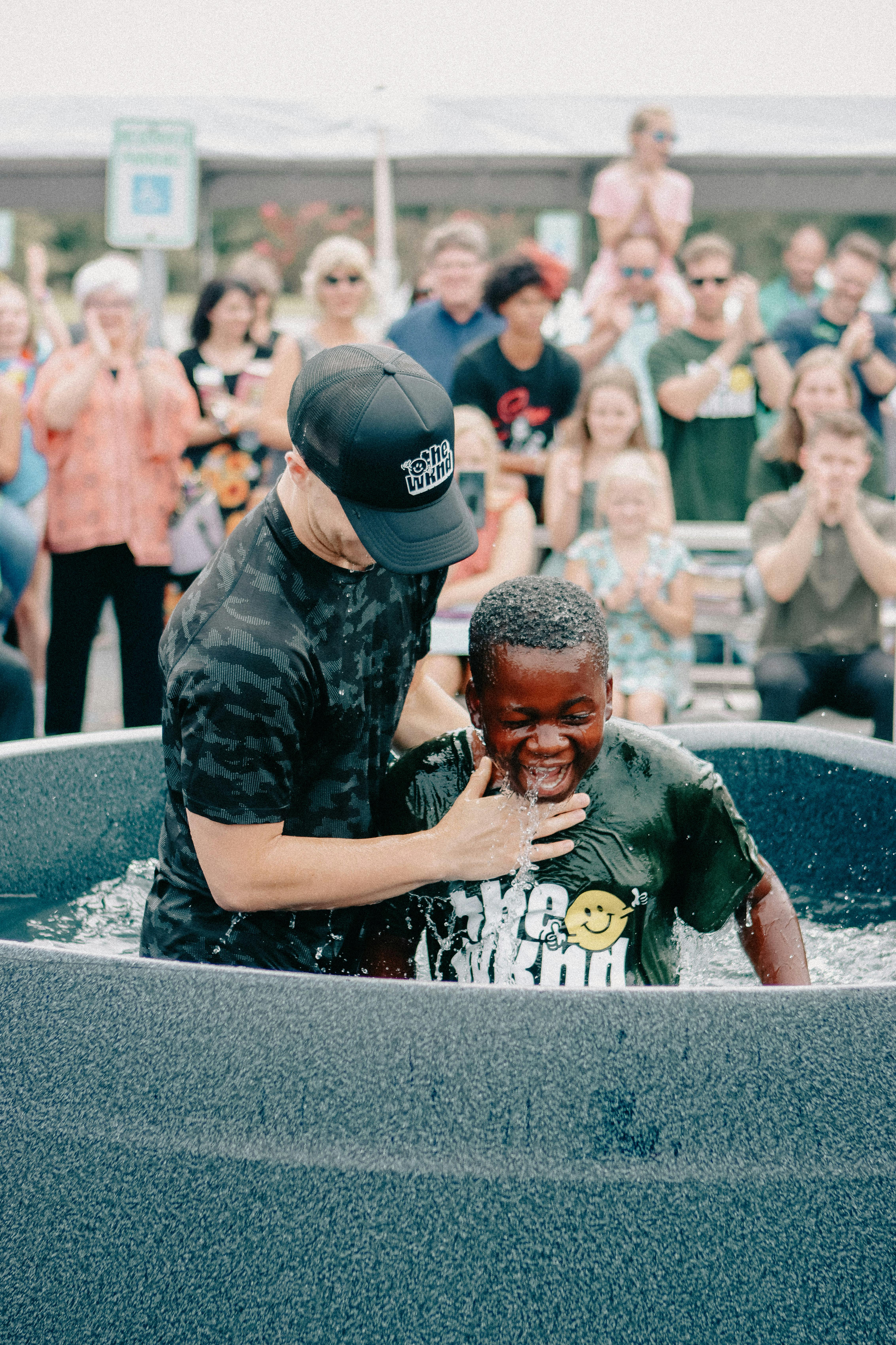 Baptism Ceremony in Outdoor Church Gathering · Free Stock Photo