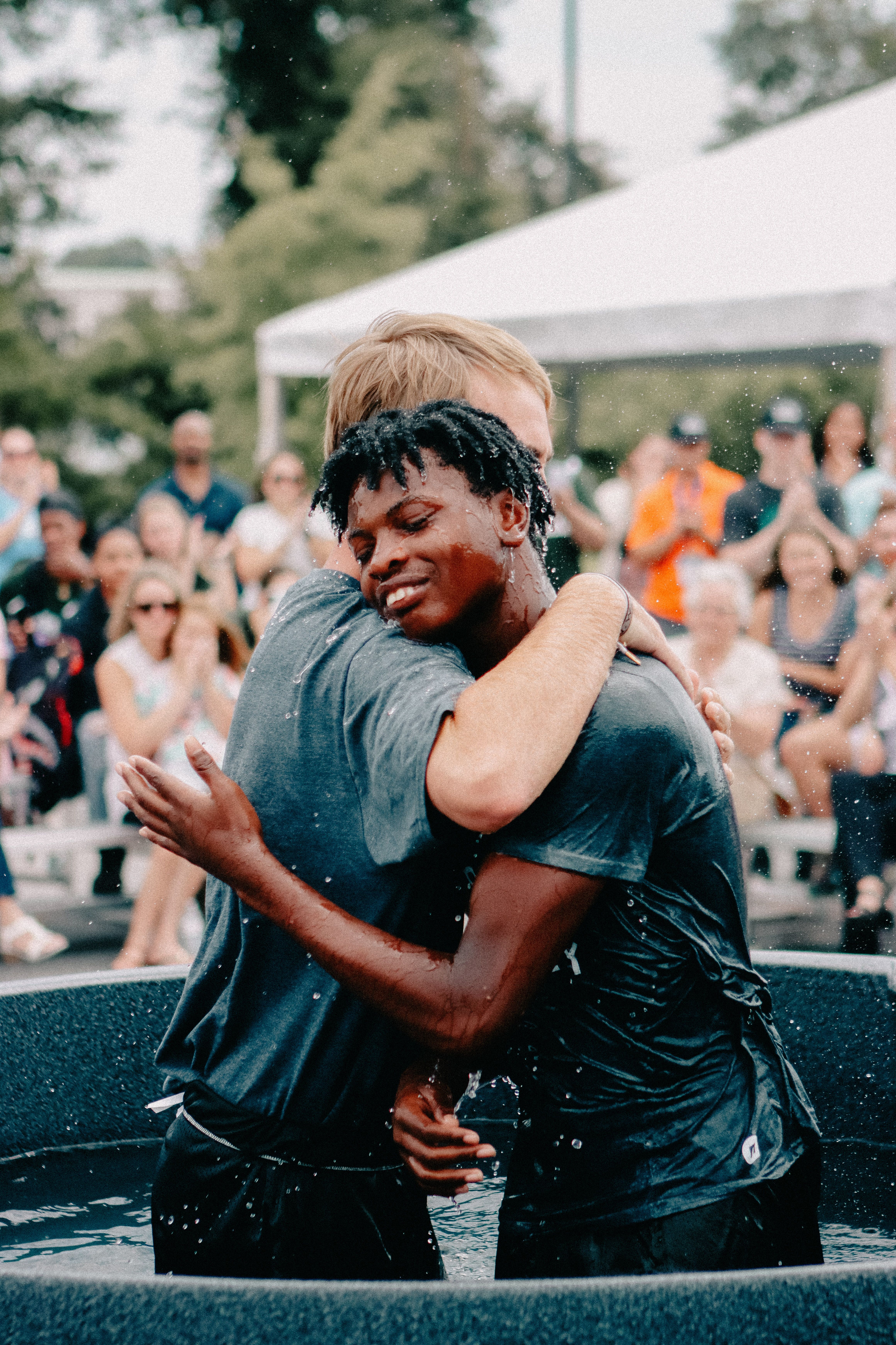 Joyful Baptism Embraced in Community Celebration · Free Stock Photo