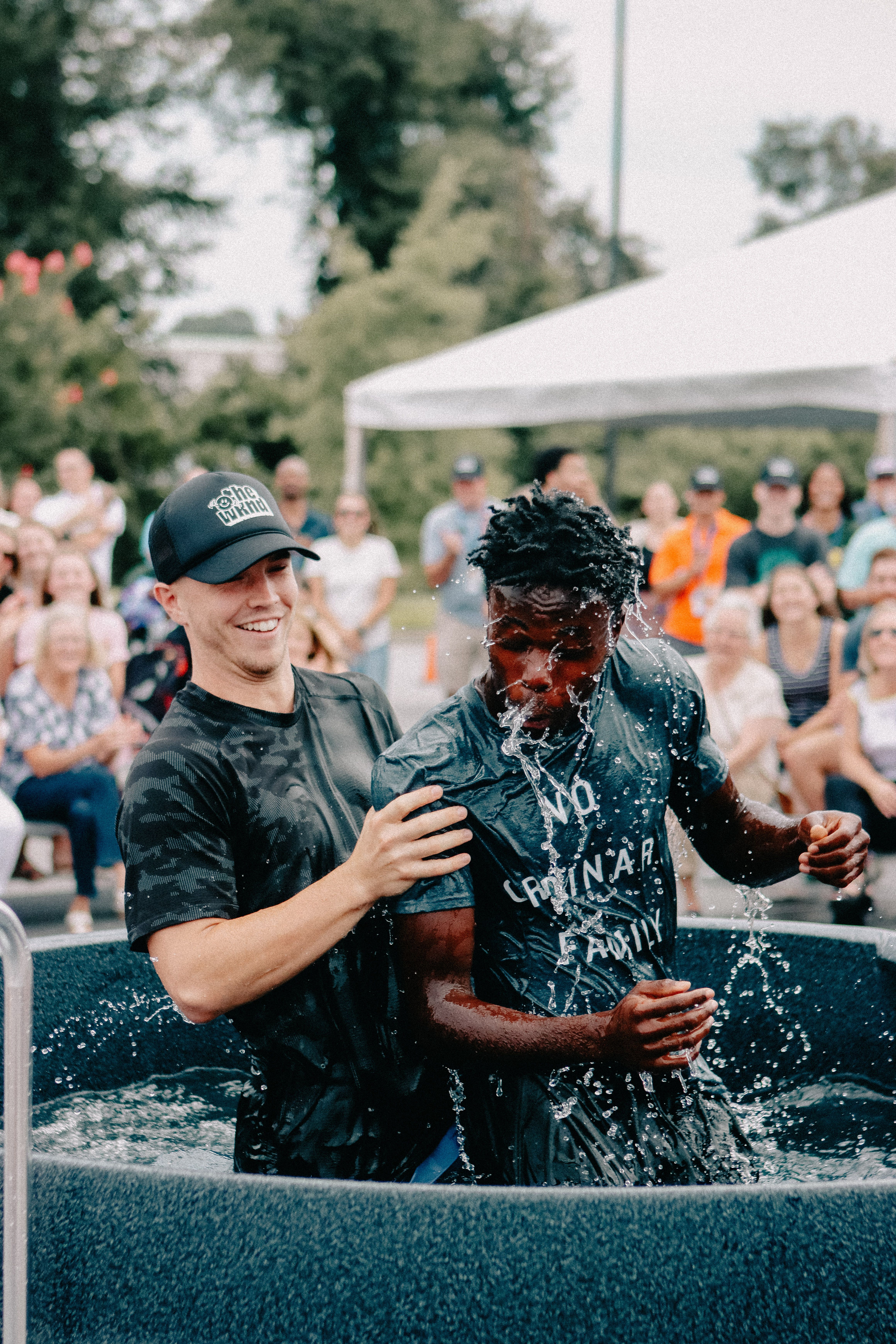 Joyful Baptism Ceremony in Outdoor Church Gathering · Free Stock Photo