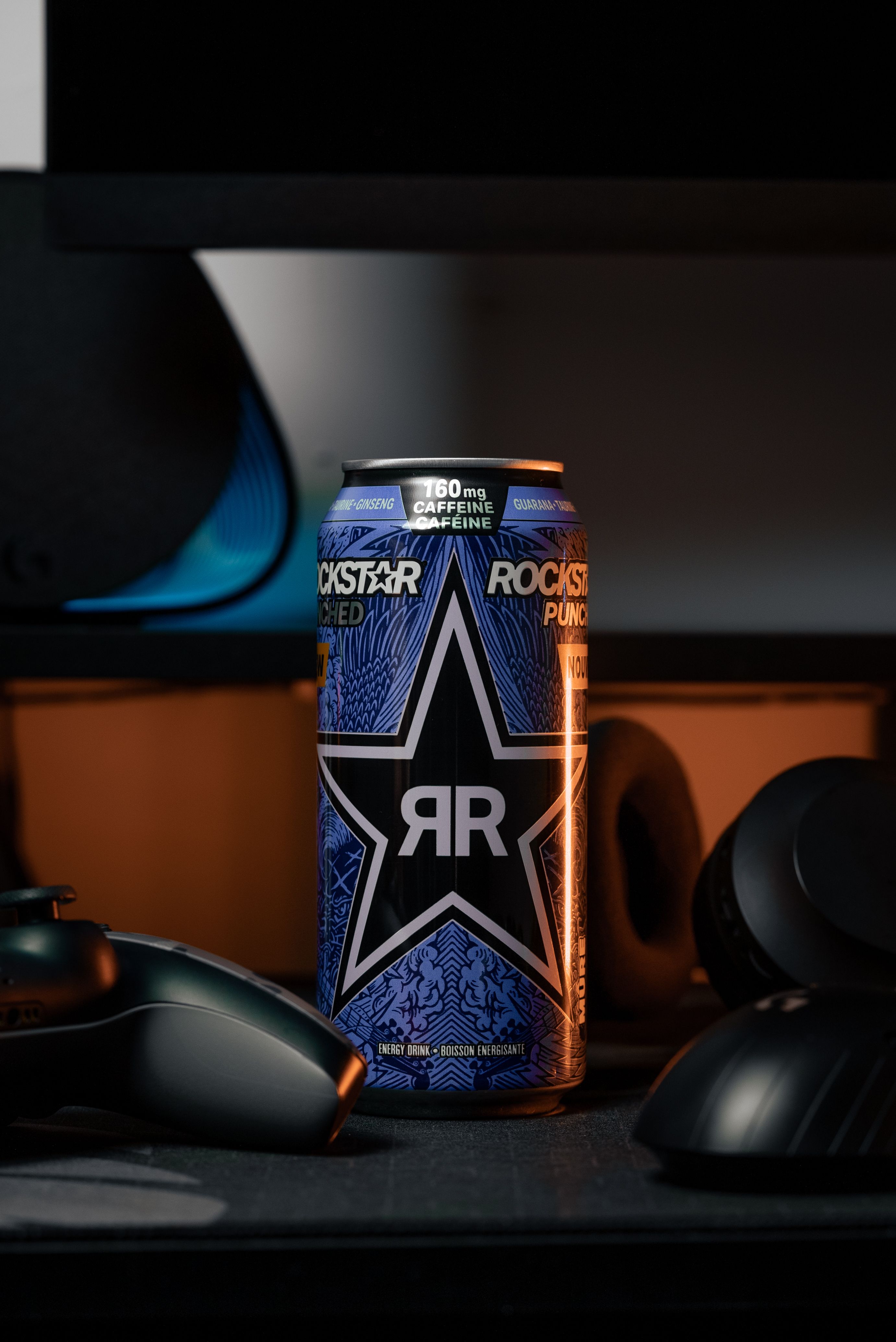 Rockstar Energy Drink on Gaming Desk Setup · Free Stock Photo