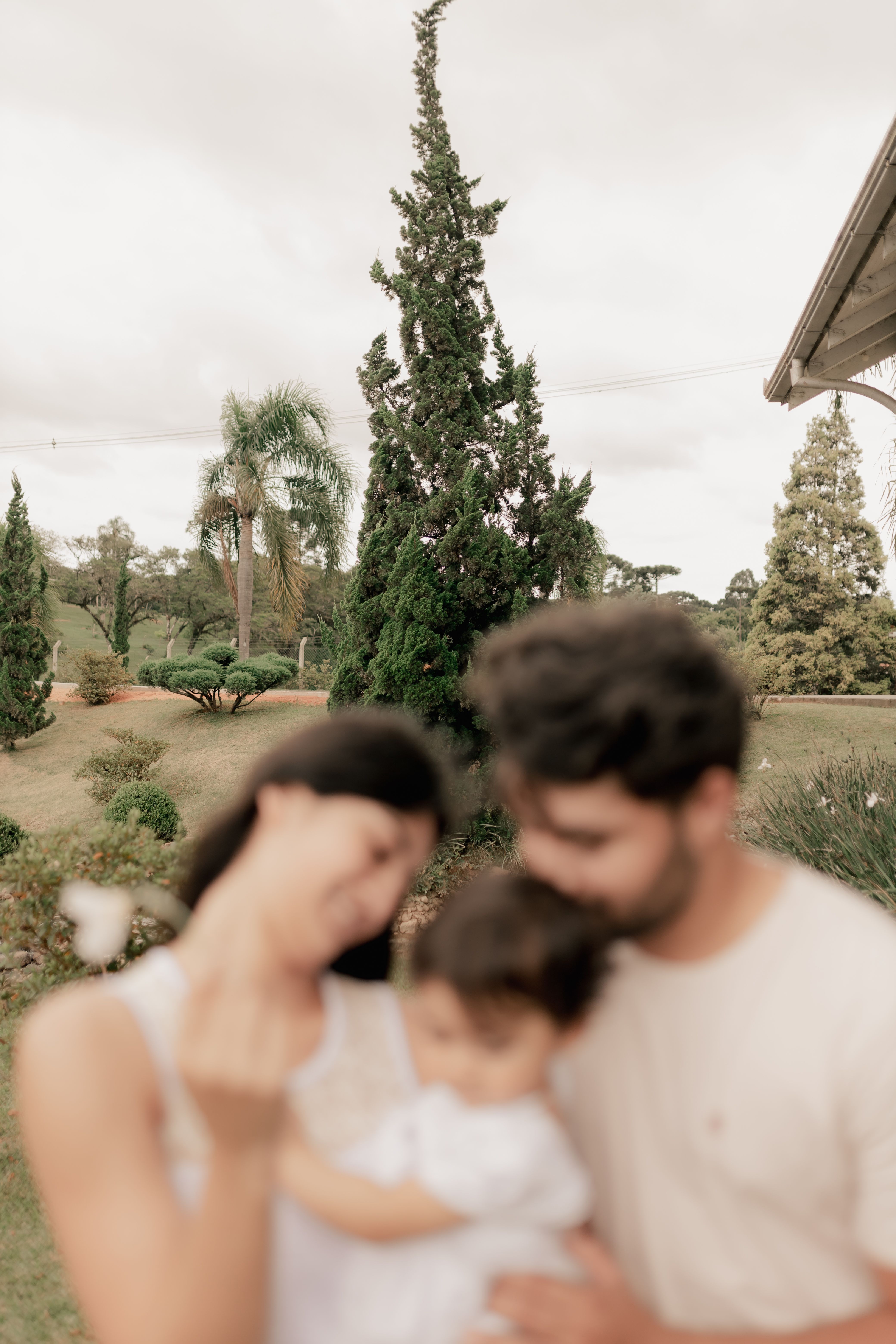 Blurred family moment in serene garden · Free Stock Photo