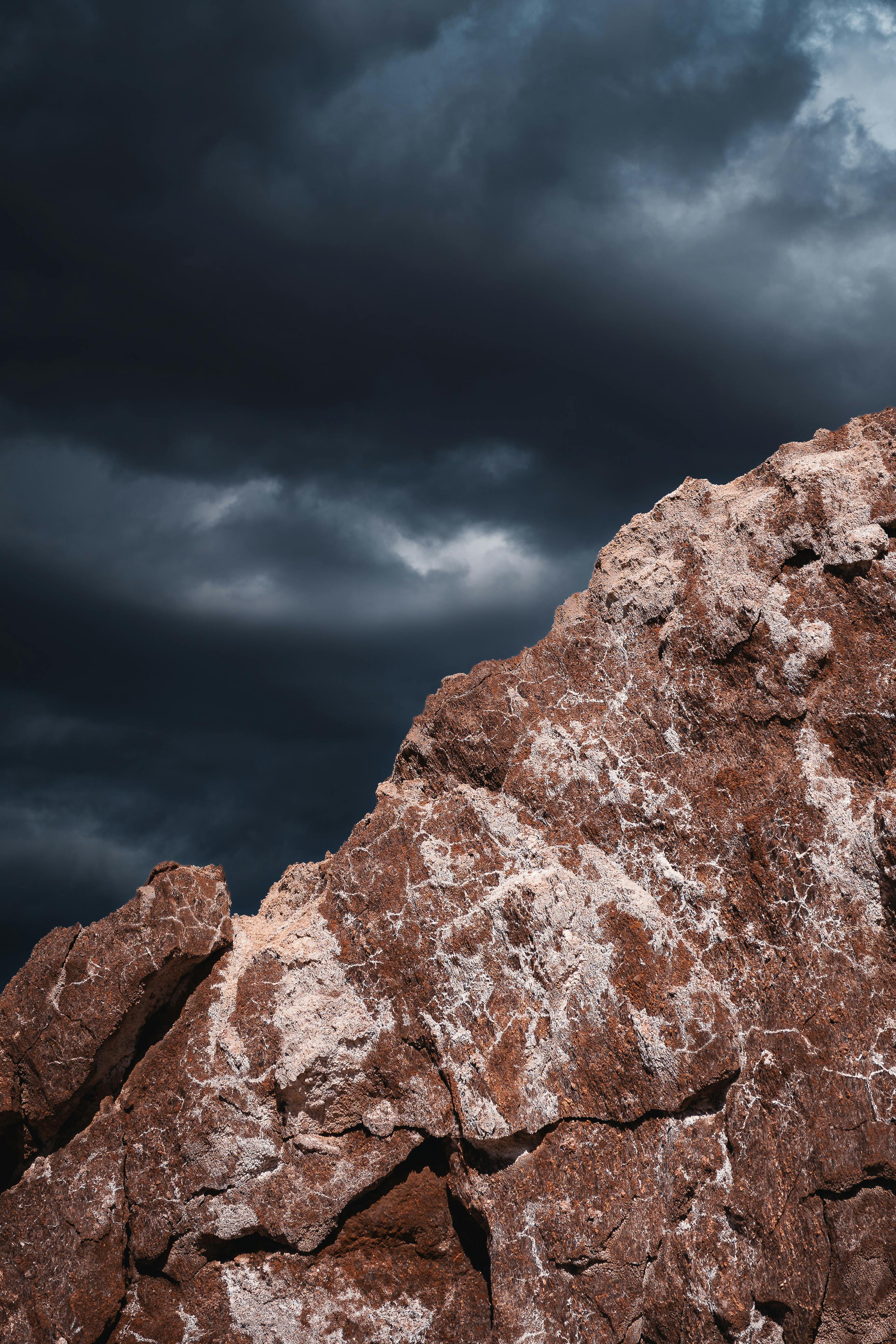 Dramatic Rocky Landscape Under Stormy Sky · Free Stock Photo