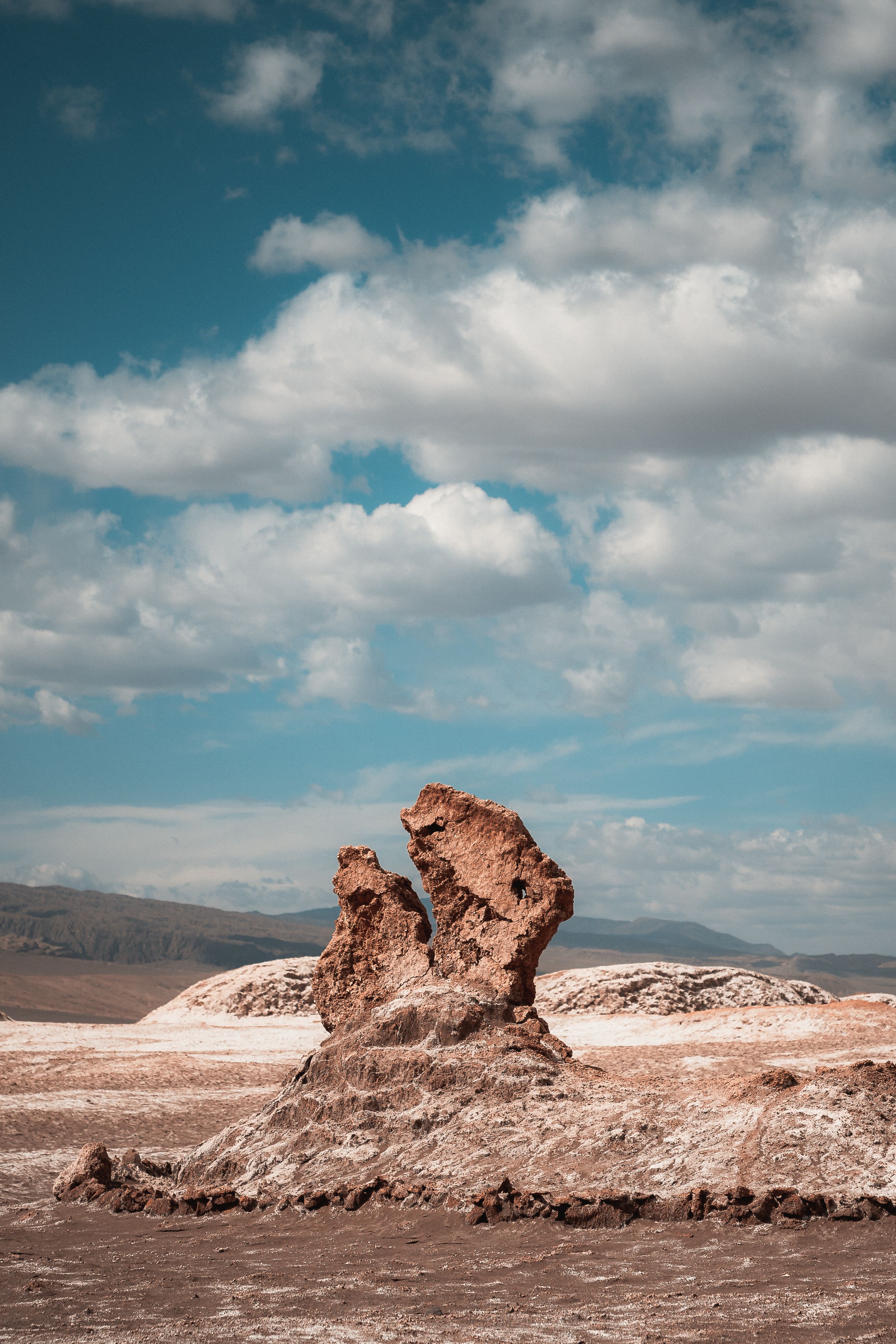 Dramatic Rock Formation under Cloudy Sky · Free Stock Photo