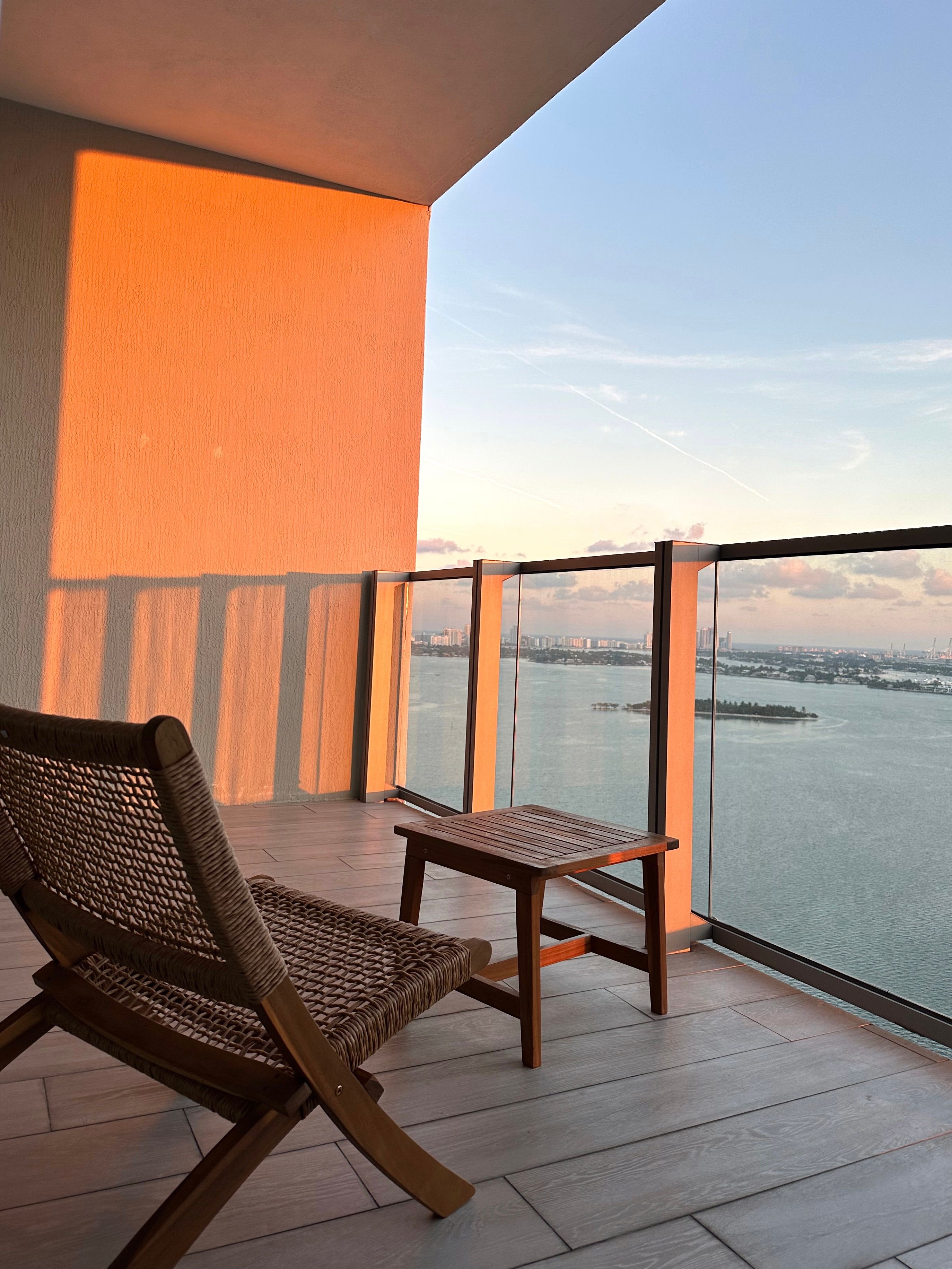 Balcony Chair Overlooking Ocean at Sunset · Free Stock Photo