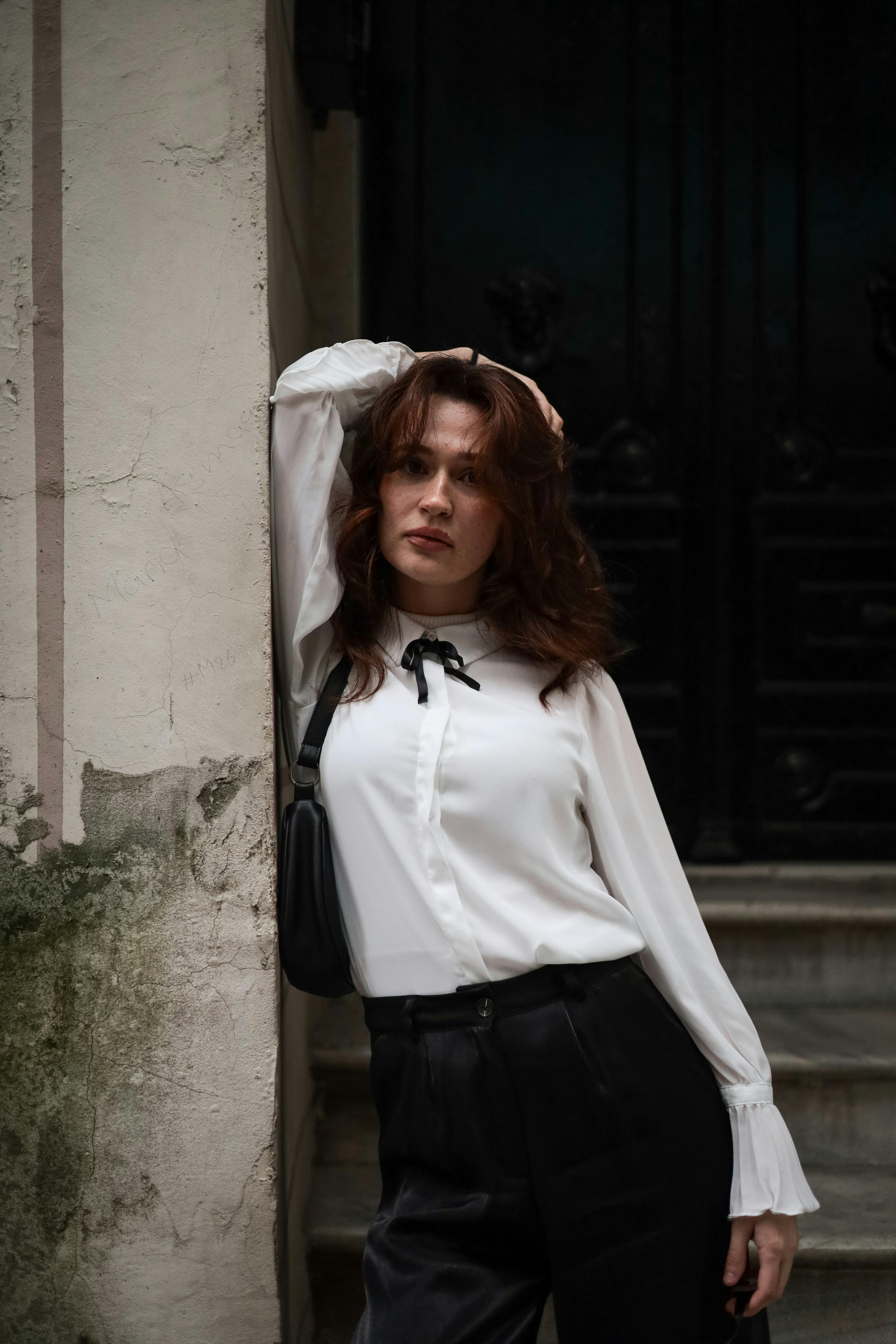 Stylish Woman Posing in Urban Alleyway · Free Stock Photo