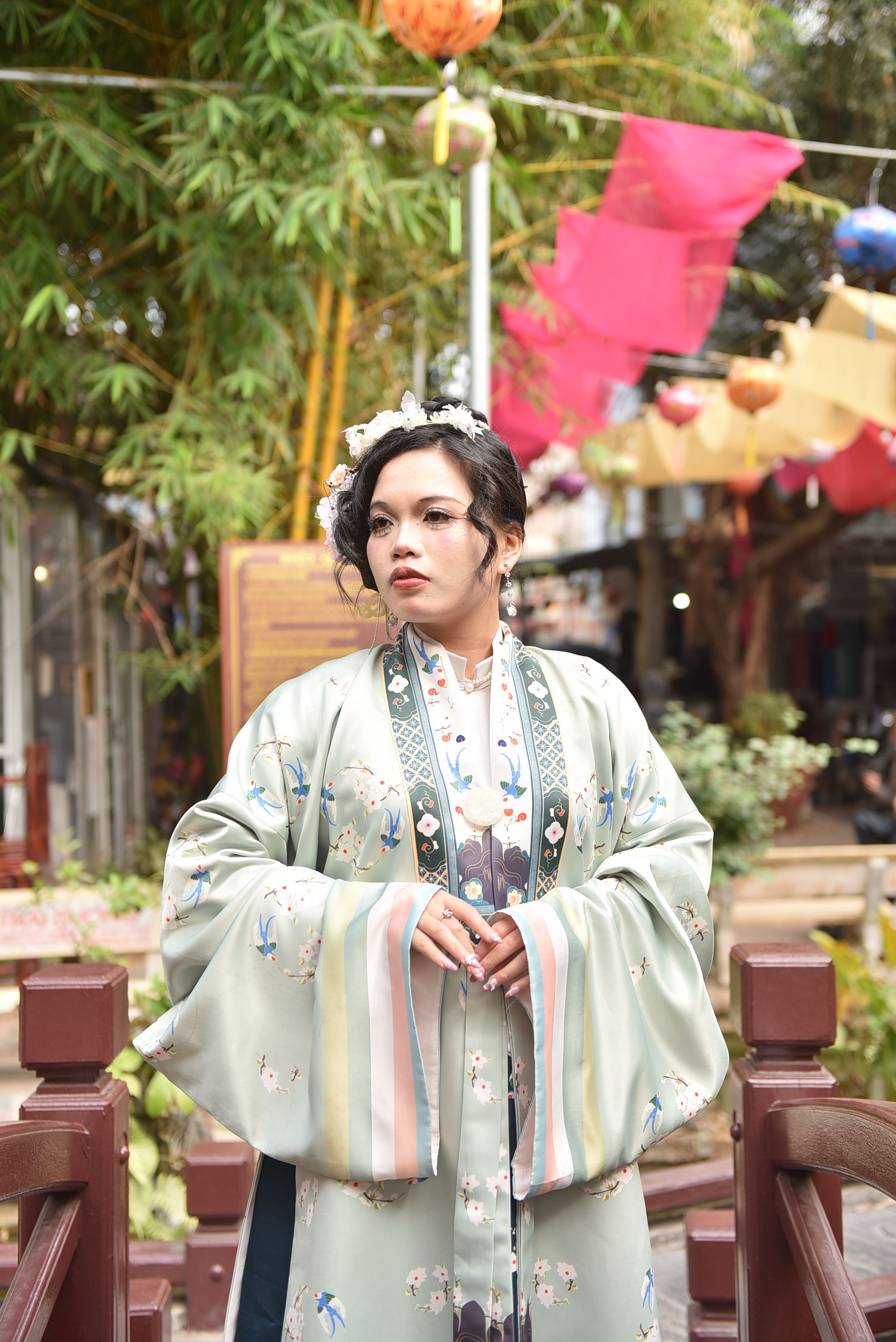Traditional Asian Attire in a Vibrant Outdoor Setting · Free Stock Photo