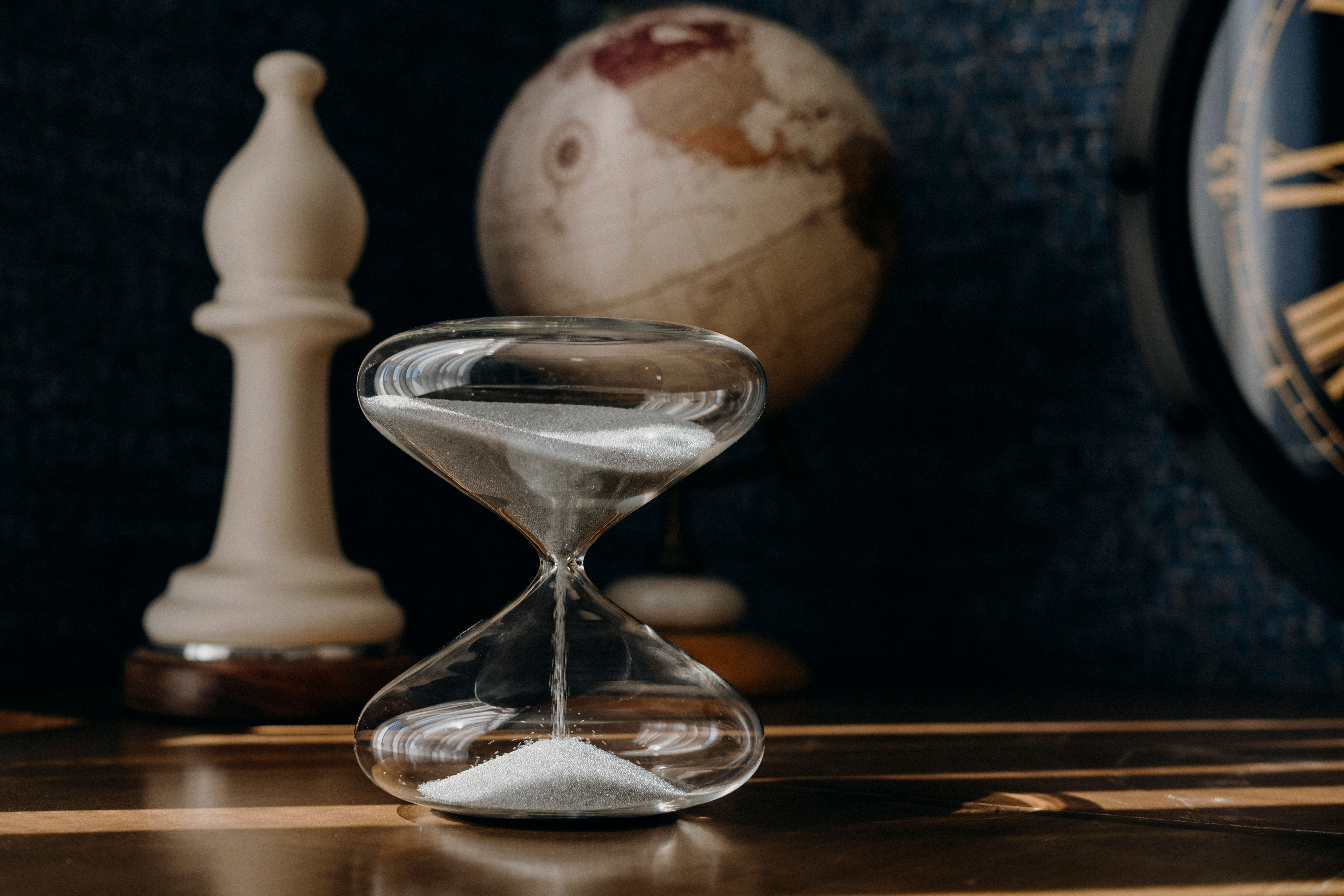 Elegant Hourglass with Globe and Clock · Free Stock Photo