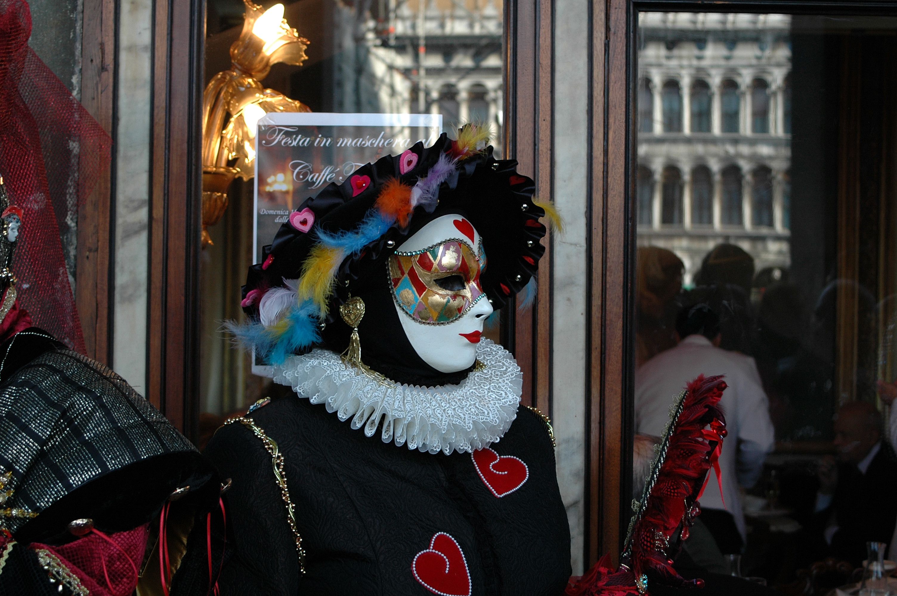 Venetian Carnival Masked Figure with Heart Motifs · Free Stock Photo