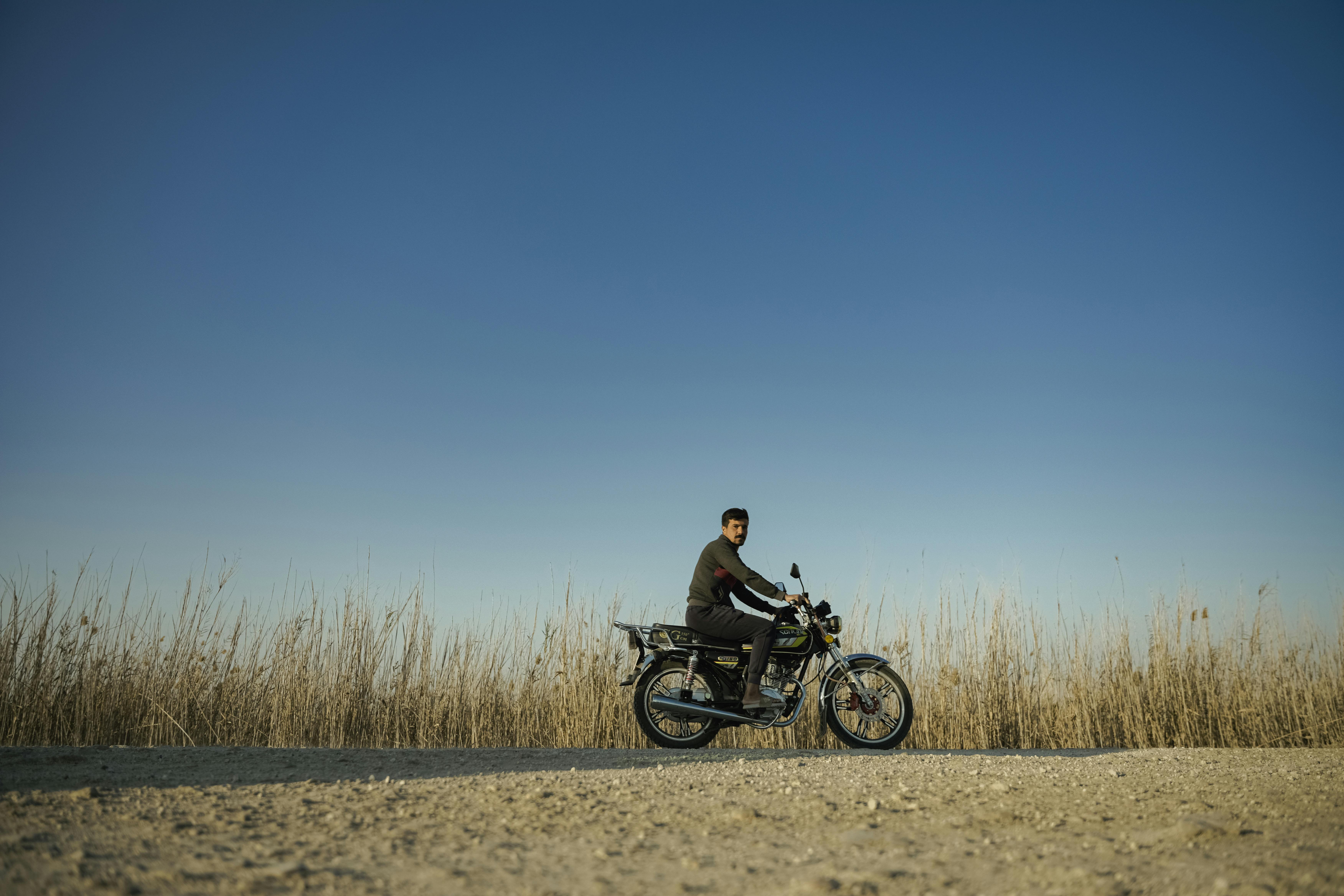 Man Riding a Motorcycle Photo · Free Stock Photo