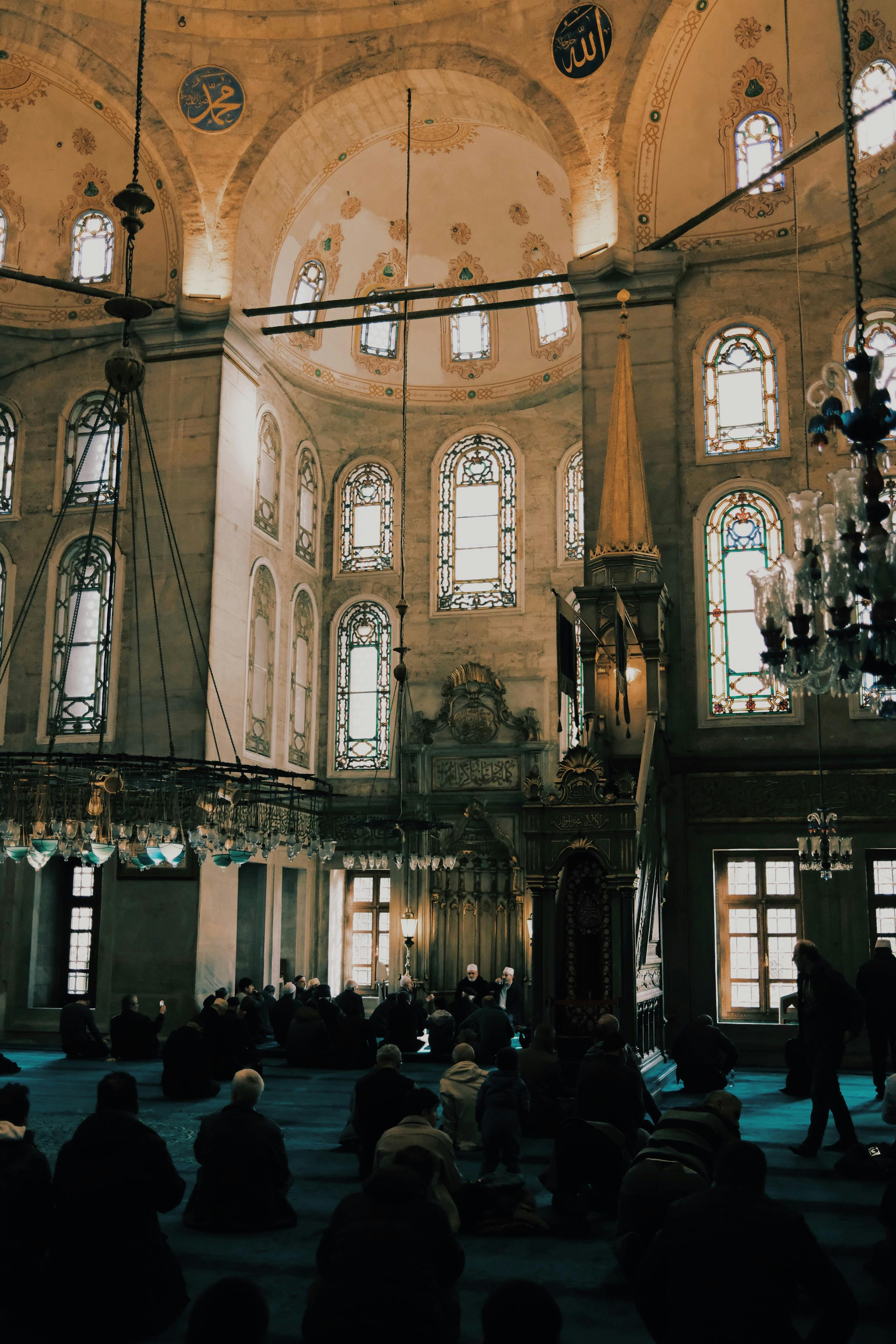 People Praying Inside a Historic Mosque · Free Stock Photo