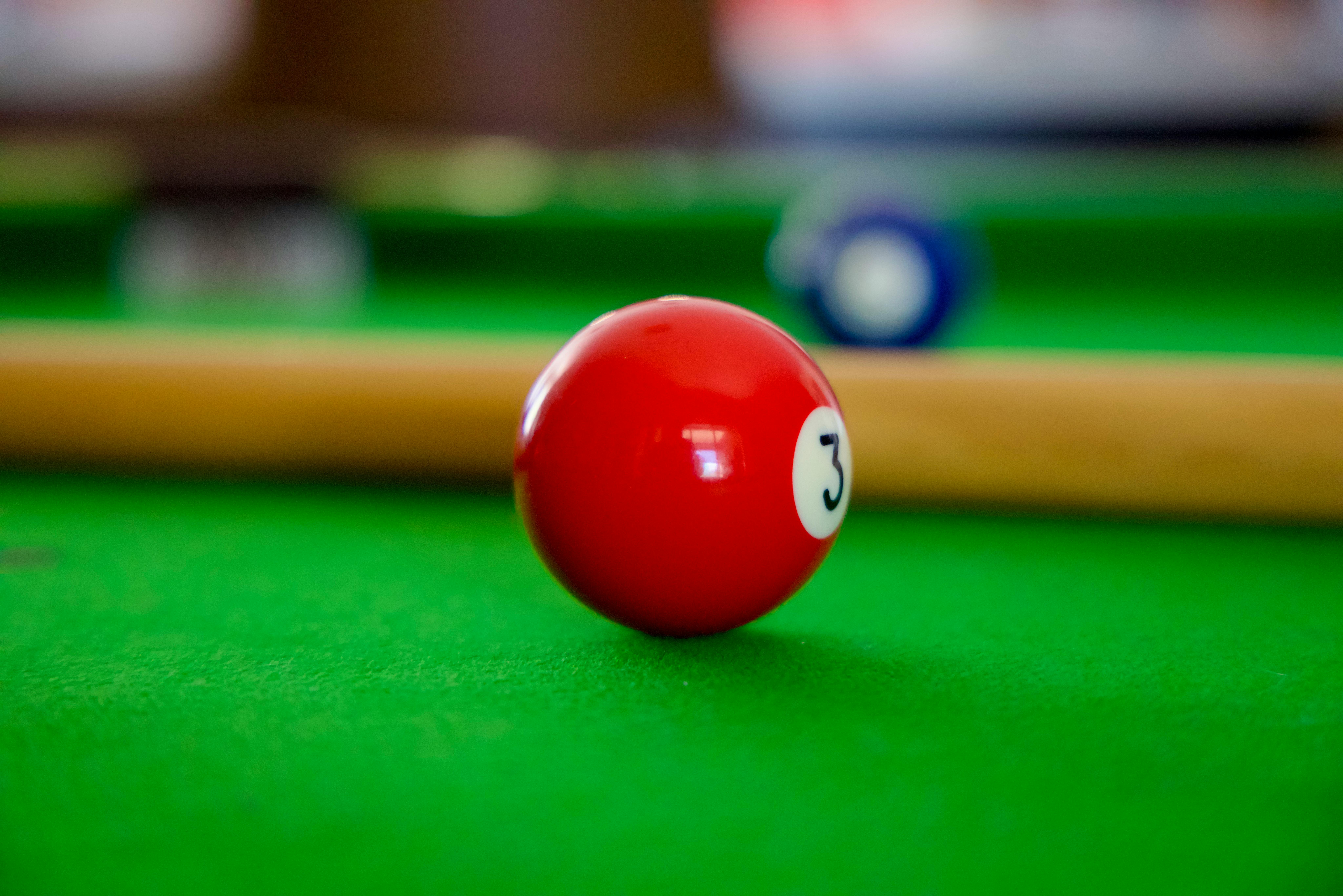 Close-up of Red Number 3 Pool Ball on Green Table · Free Stock Photo