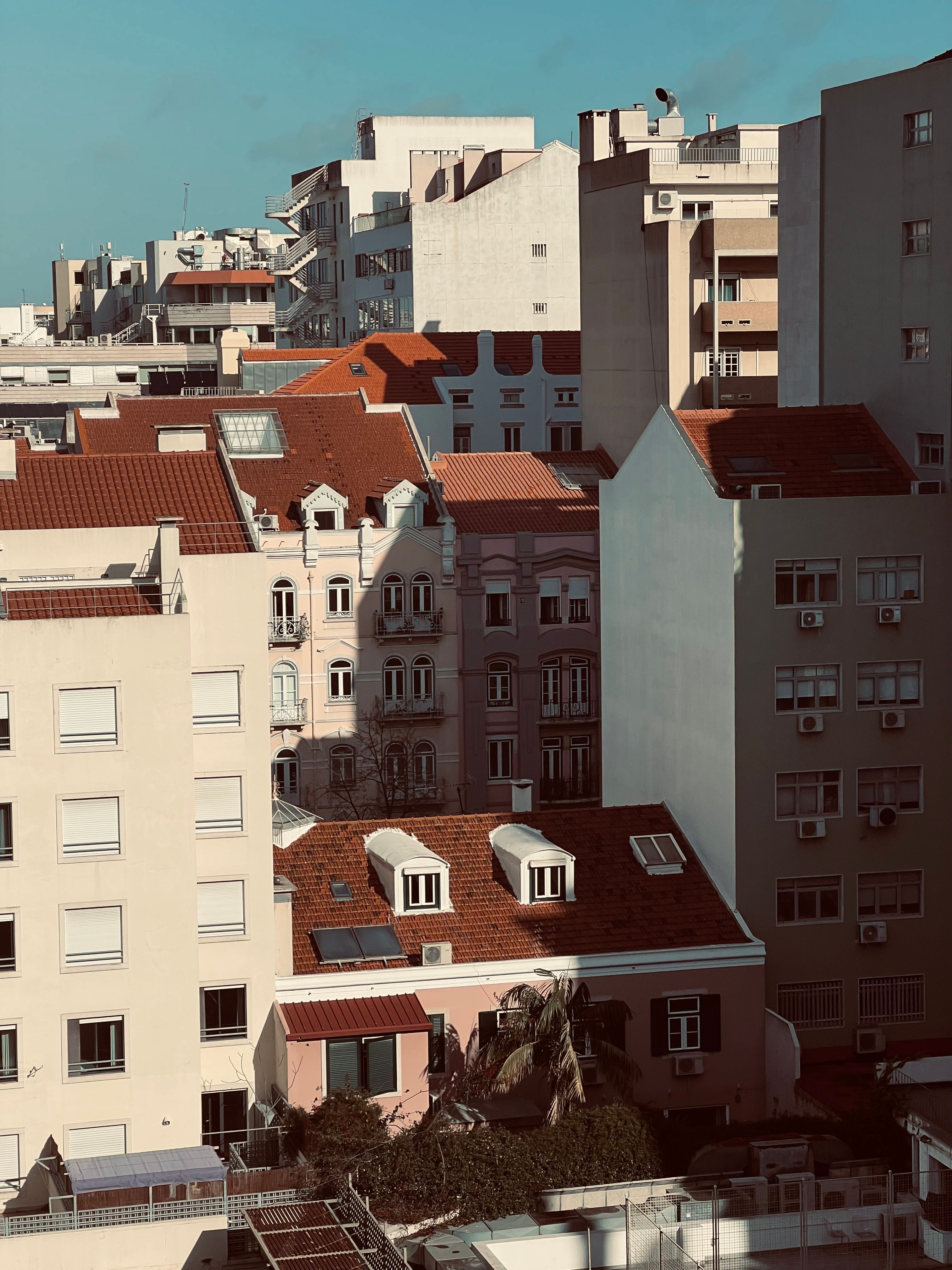 Charming European Urban Rooftops in Sunlight · Free Stock Photo
