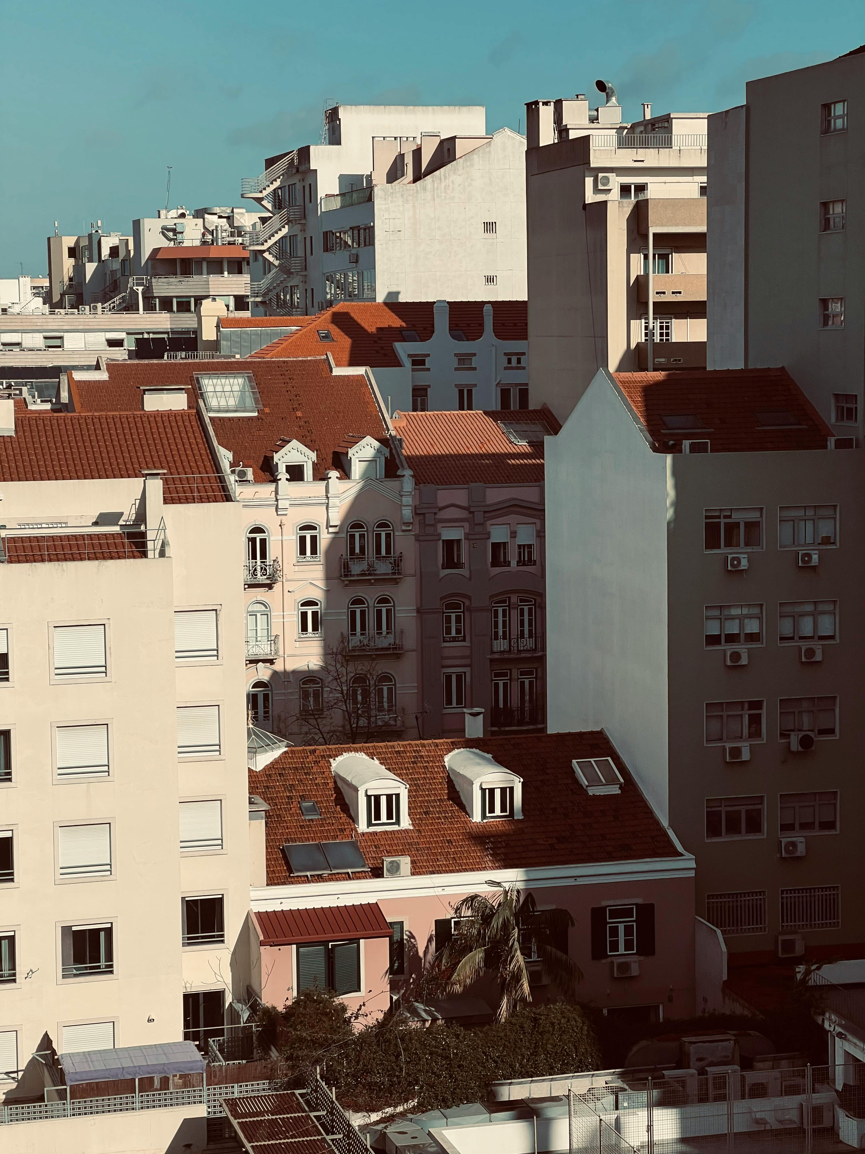 Charming European Urban Rooftops in Sunlight · Free Stock Photo