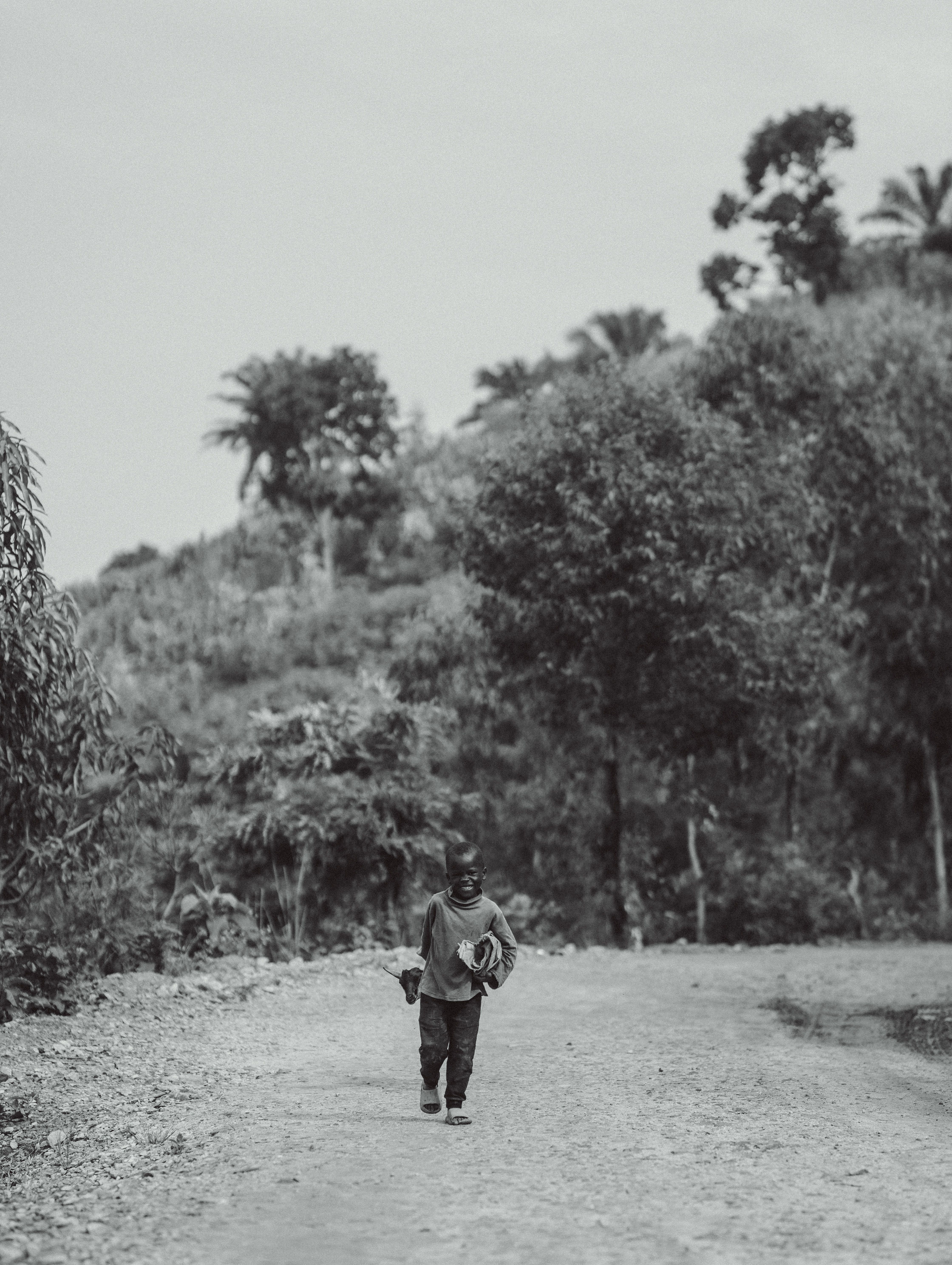 Solitary Child Walking on a Rural Pathway · Free Stock Photo