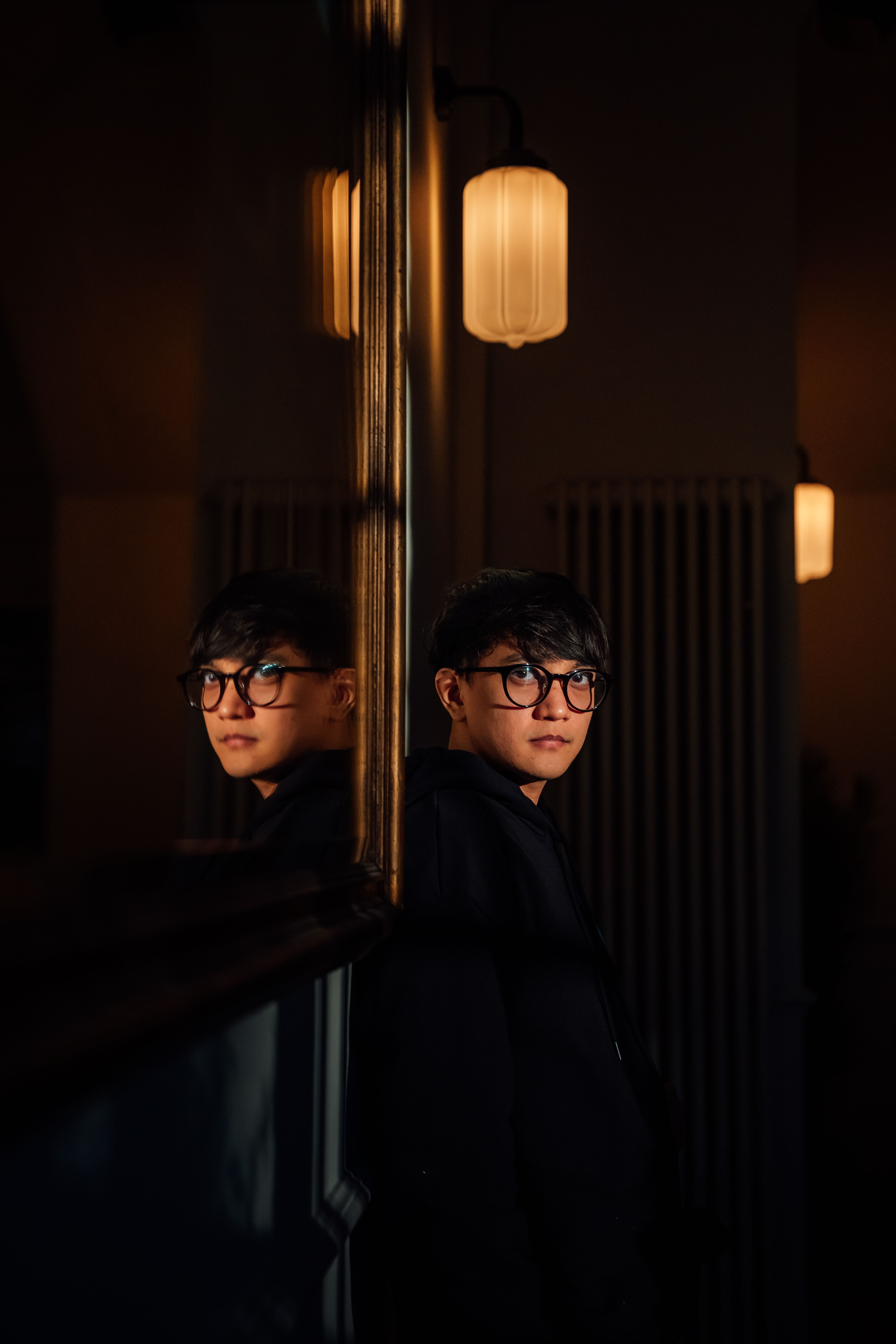 Moody Portrait Reflected in Dim Light · Free Stock Photo