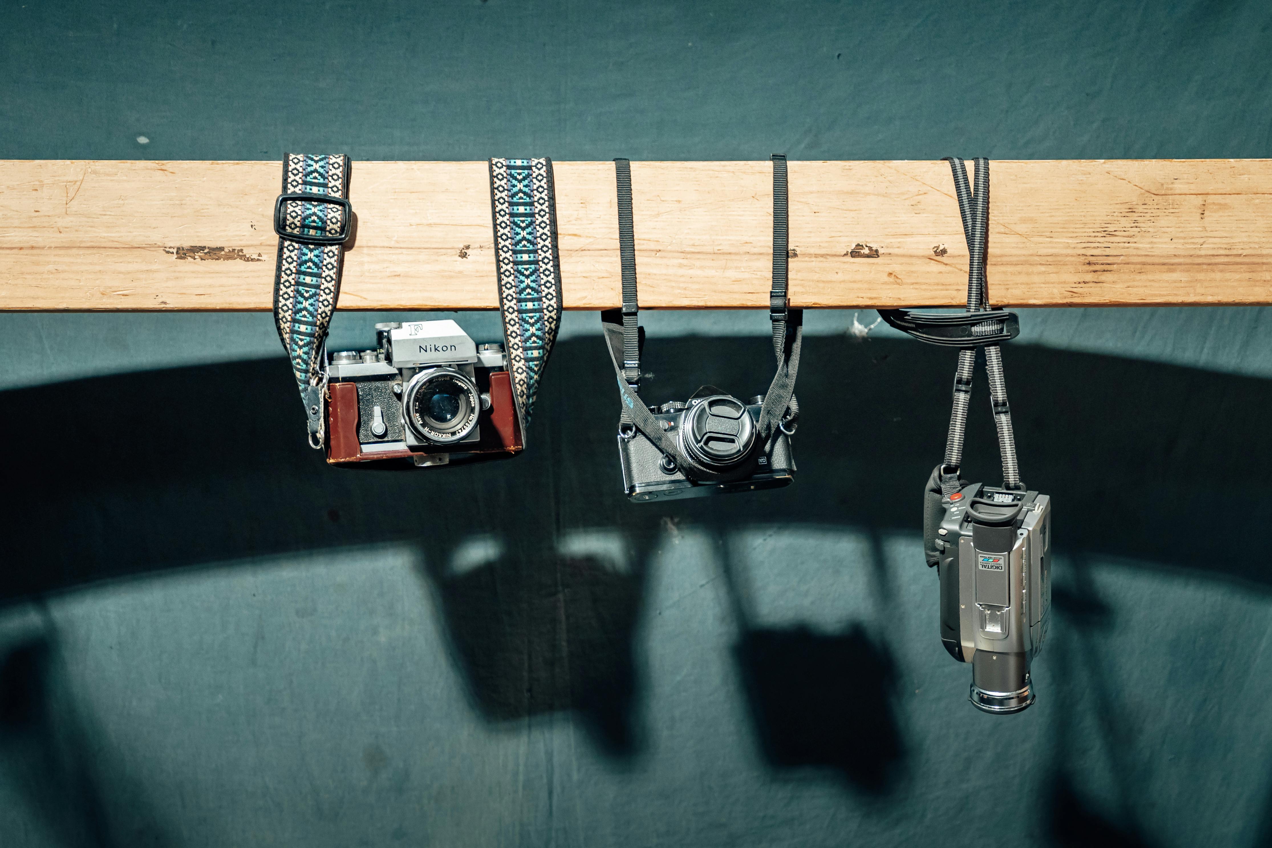 Vintage Cameras Hanging Display in Studio · Free Stock Photo